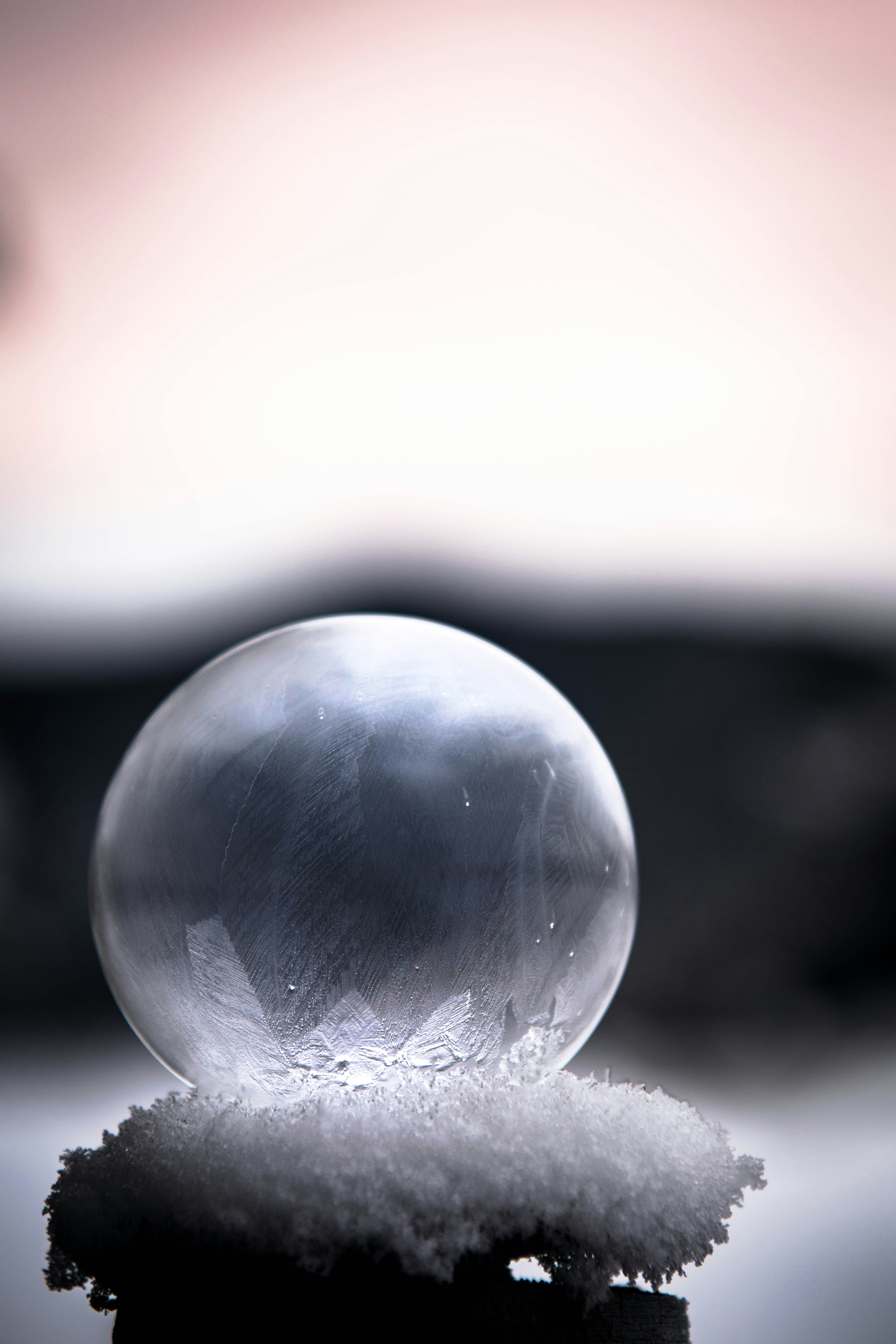 Crystal Sphere on Frosted Bed: A Quiet Macro Moment at Sunset
