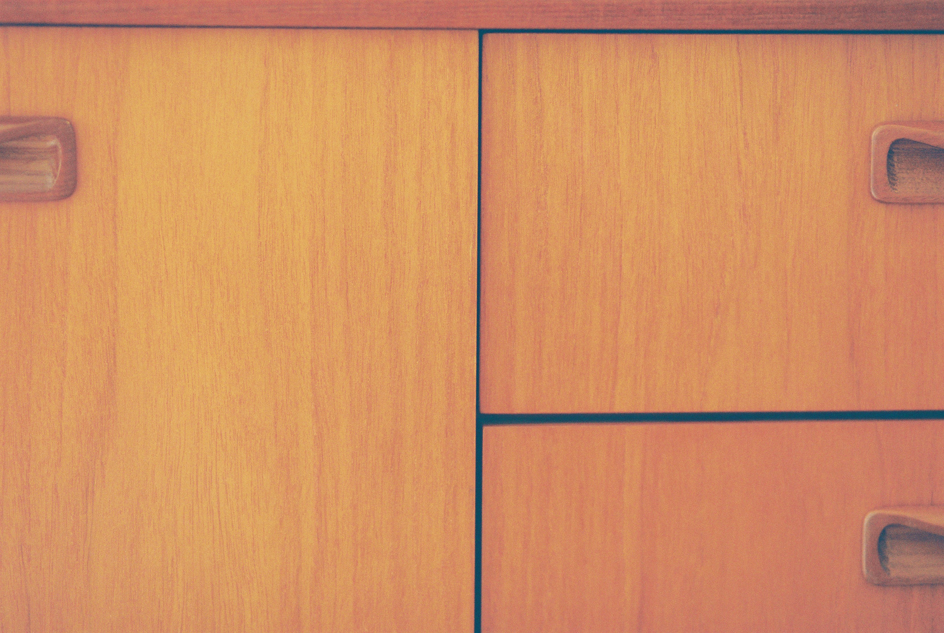 Warm Lines: A Close-Up of a Wooden Cabinet Facade