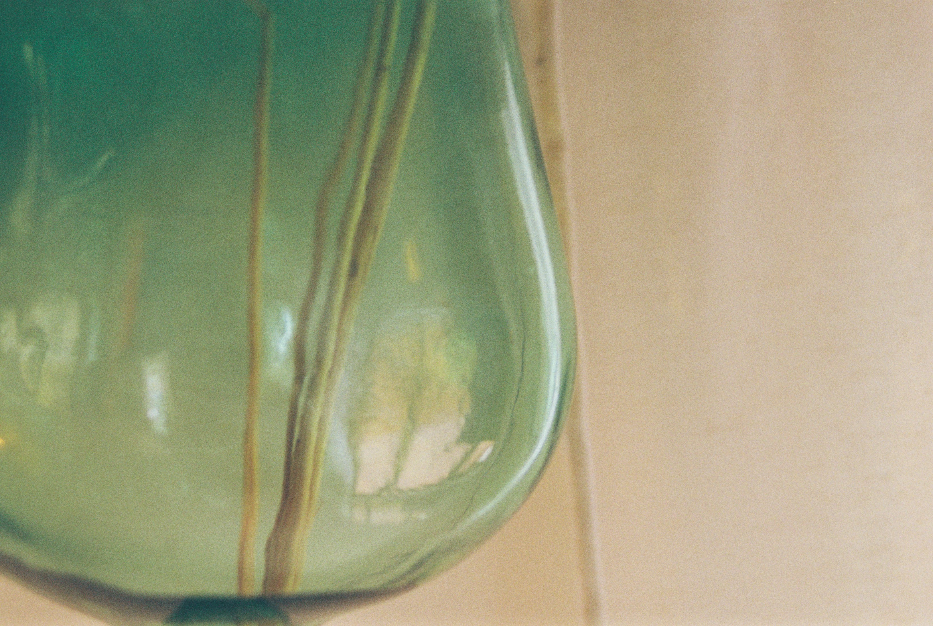 Aqua Vein: Close-Up of Glass Vessel with Internal Streaks
