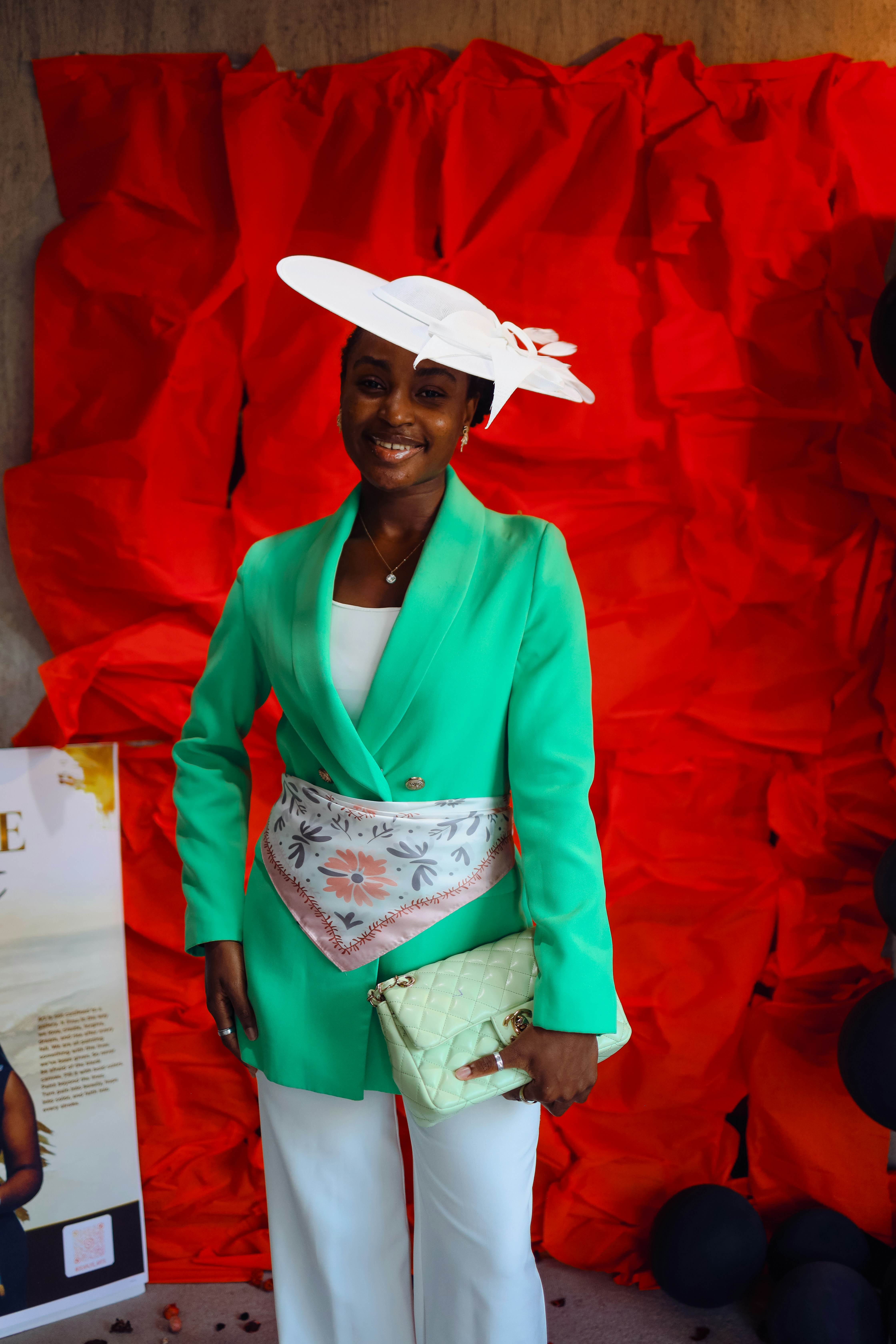 Emerald Elegance: A Bright Moment in Red Velvet Backdrop