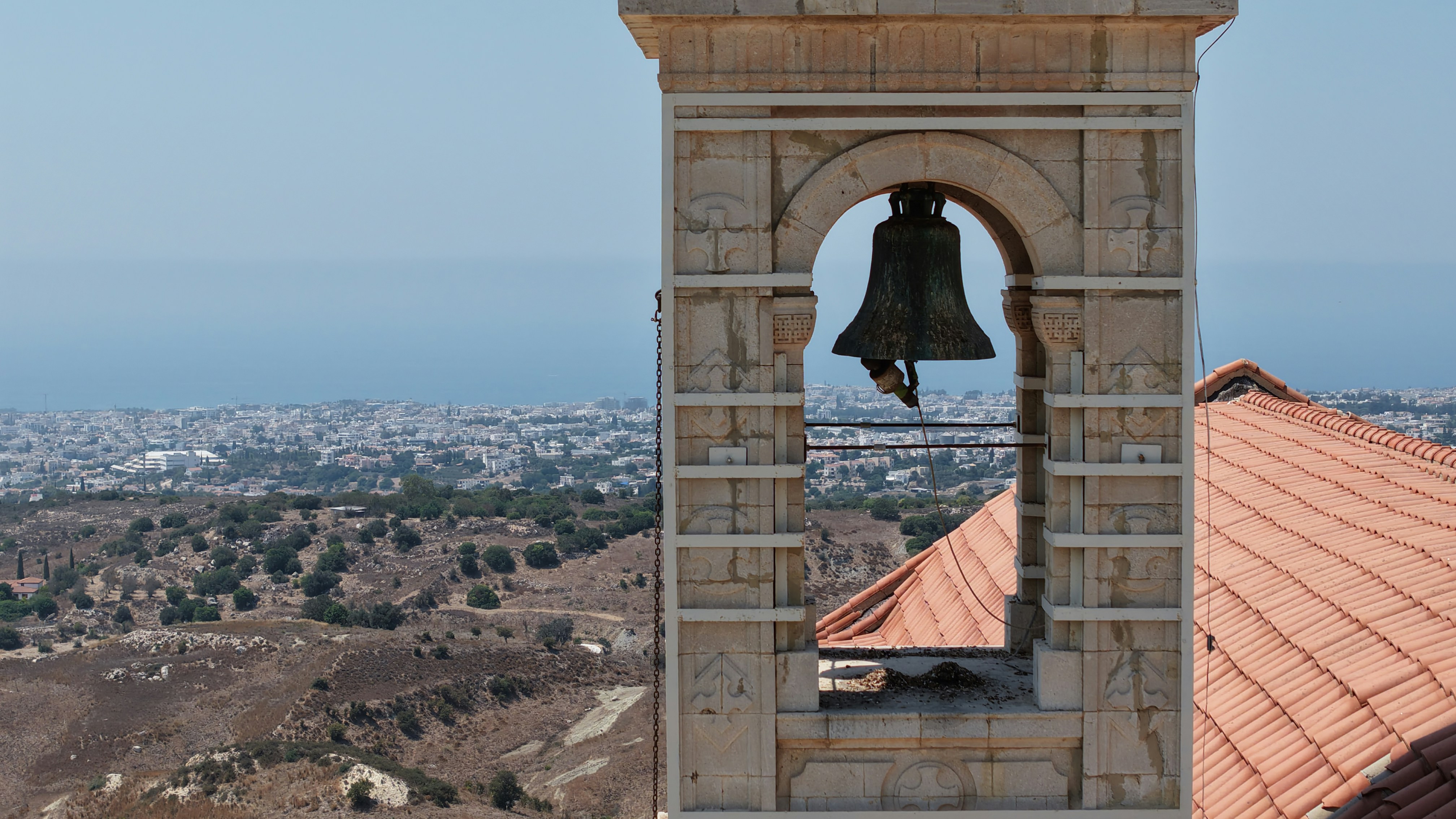 Bell Tower over a Coastal Landscape
