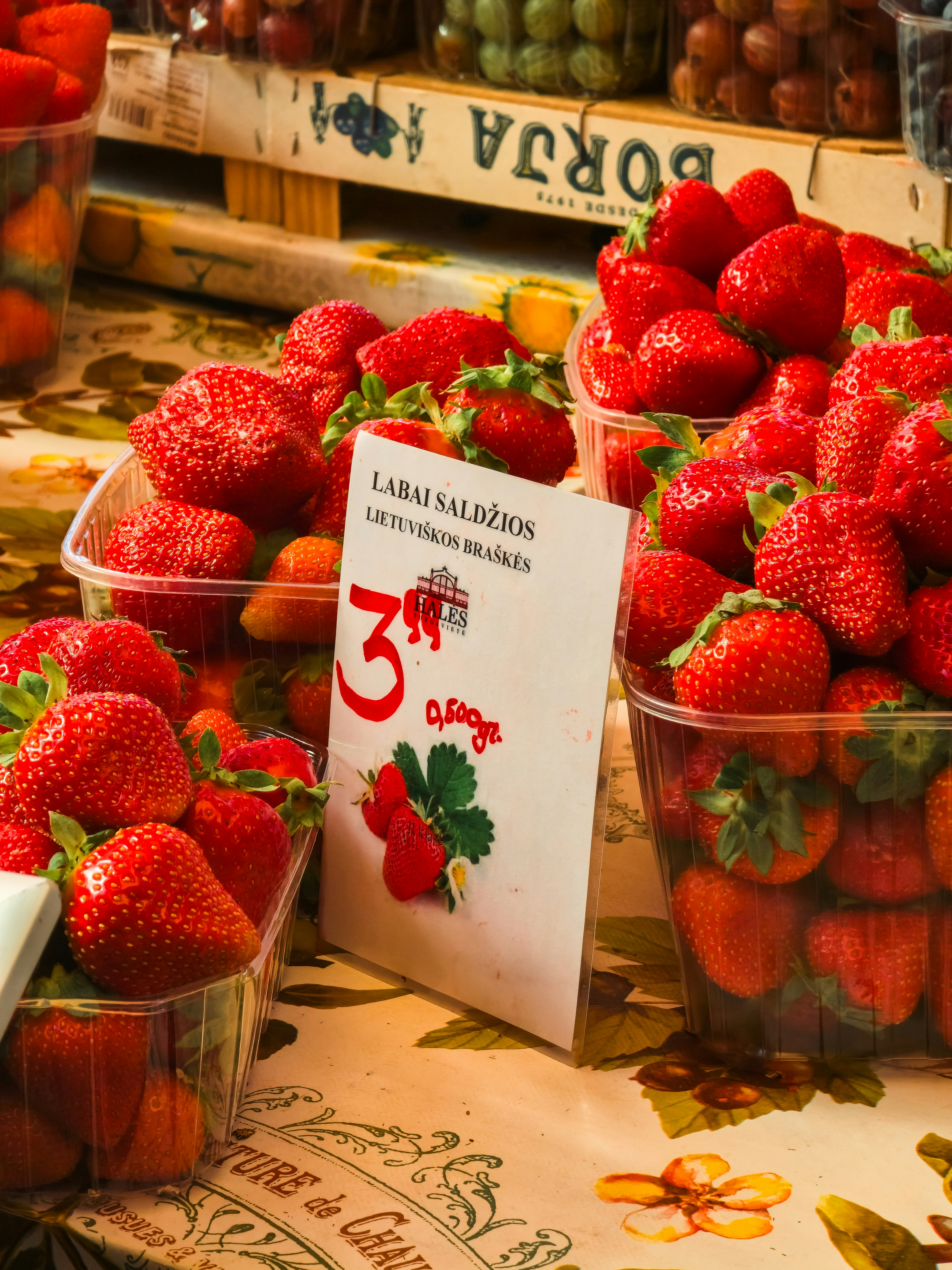 Scarlet Baskets: Fresh Strawberries at Market Stall