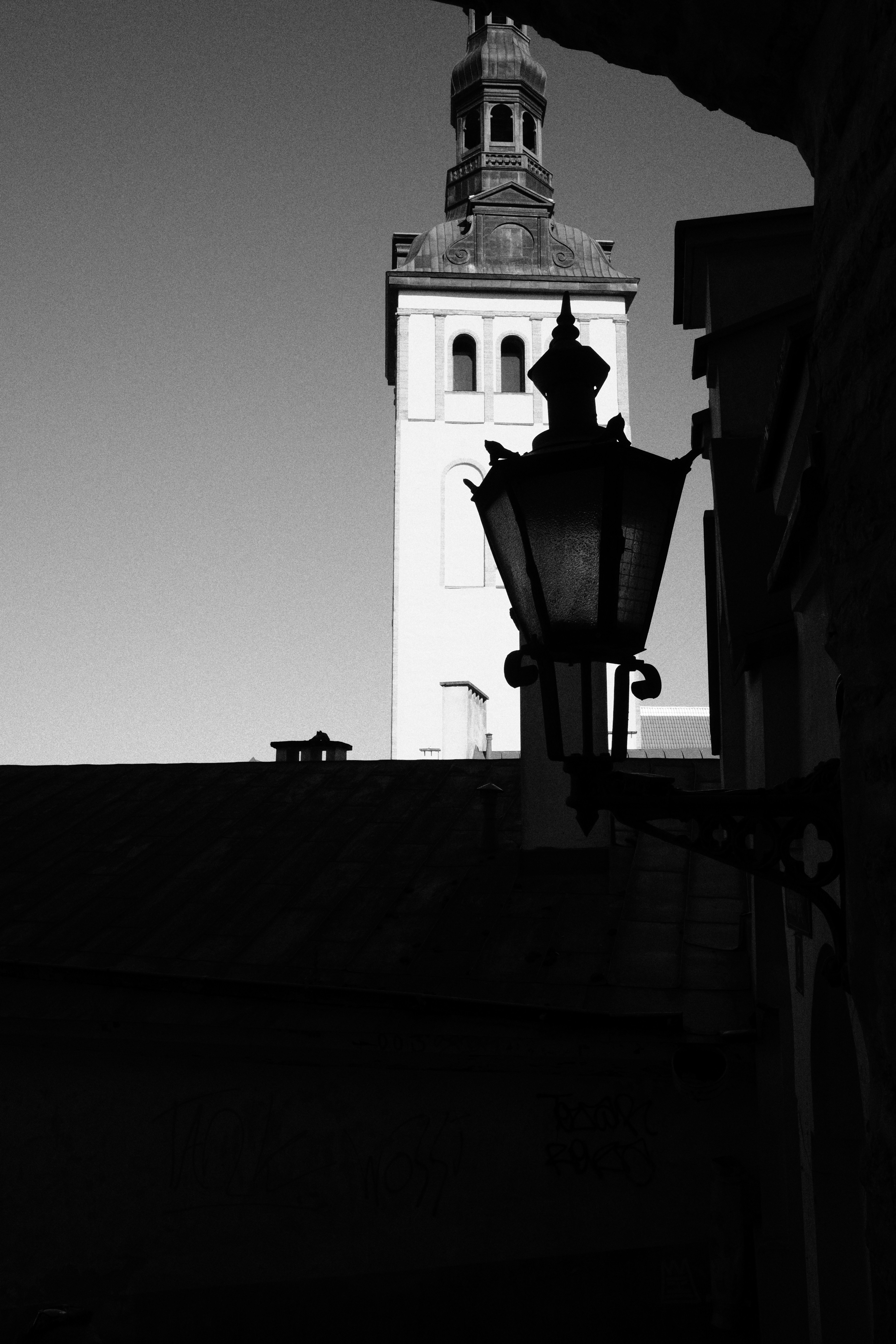 Tower Silhouette Beyond a Narrow Arch