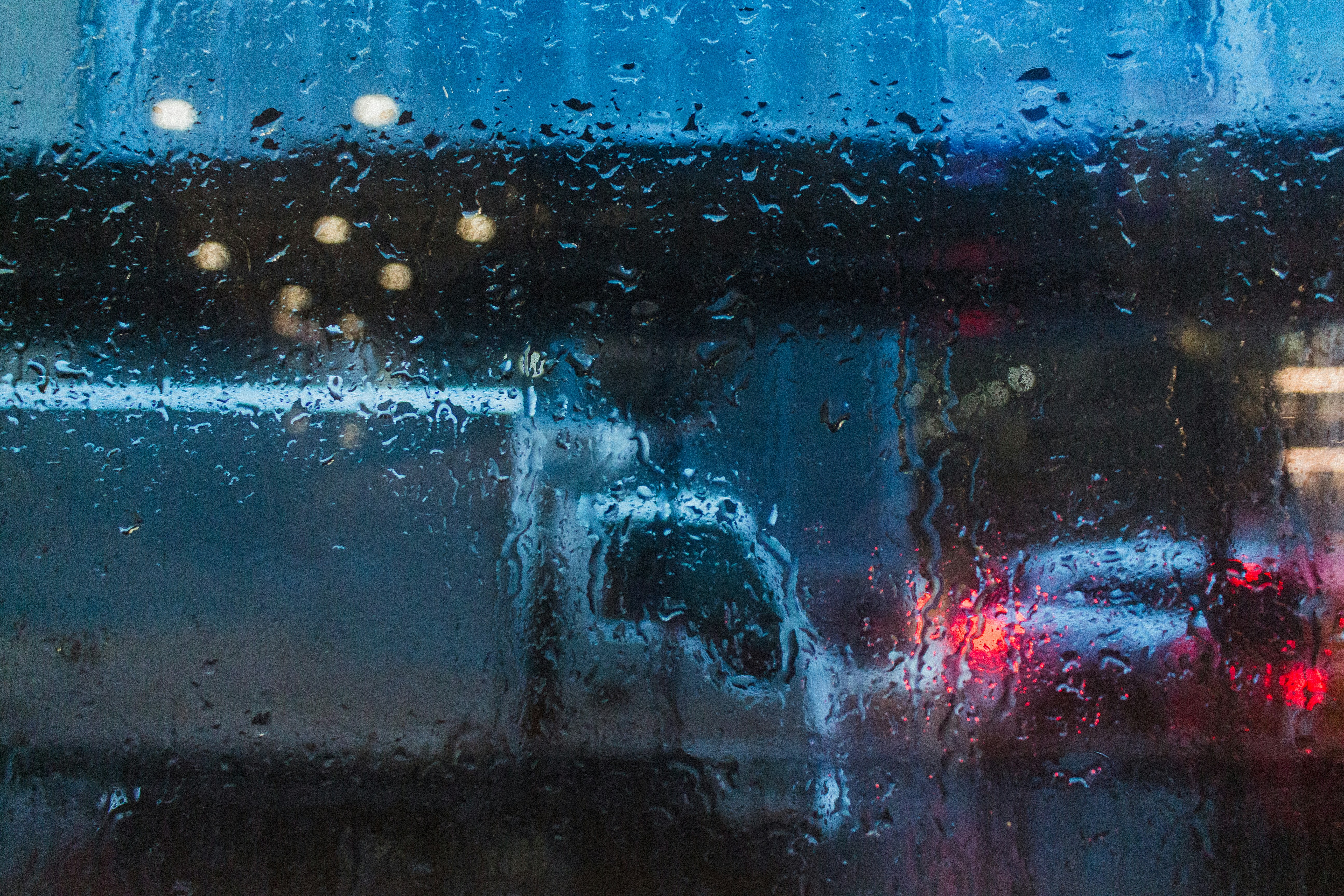 Rain-Streaked Window, Neon City Lights Blurred Beyond