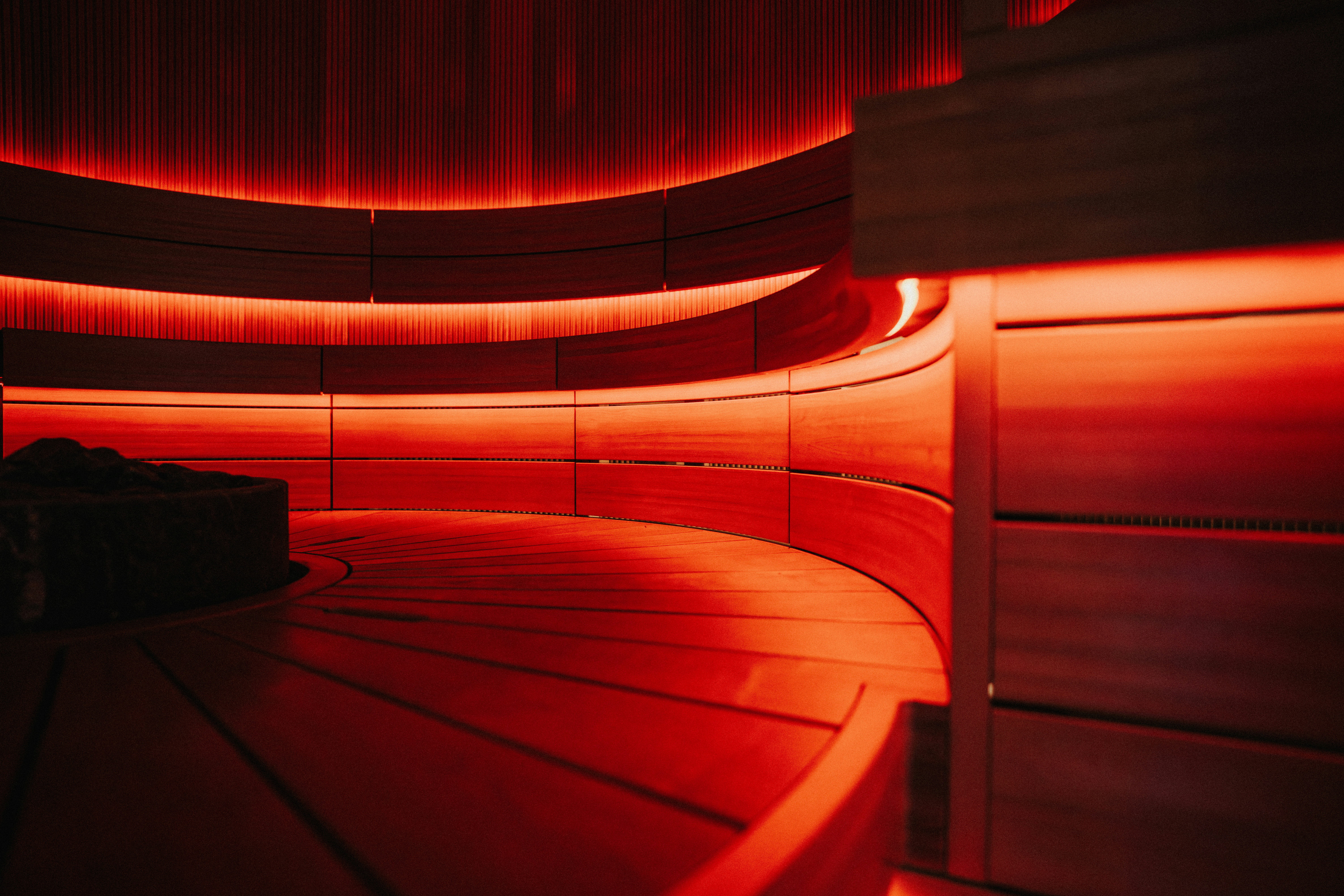 Scarlet Echoes: Curved Red Hall in Velvet Light