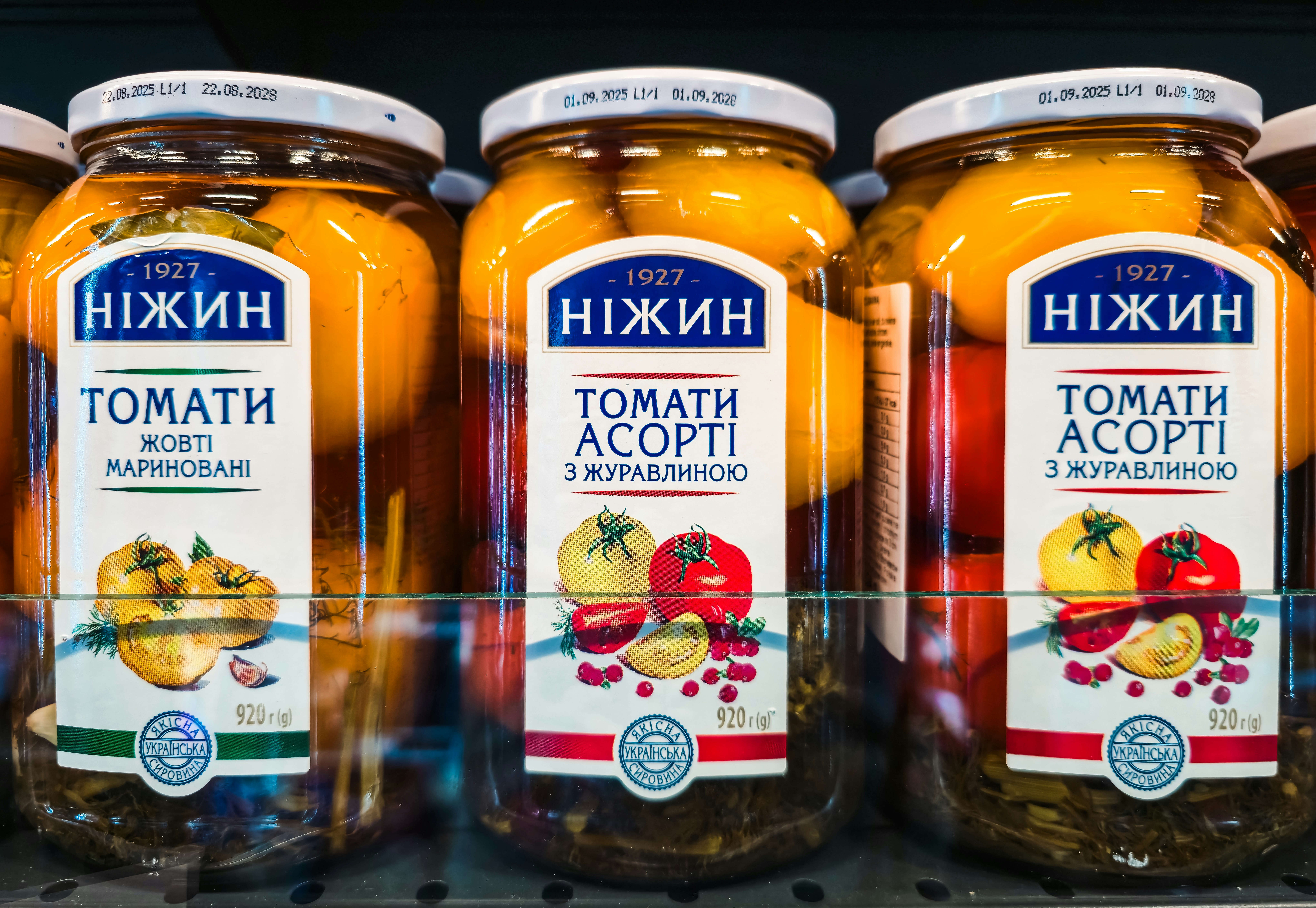 Jarred Tomatoes in Glass Shelves: Colorful Russian Labels