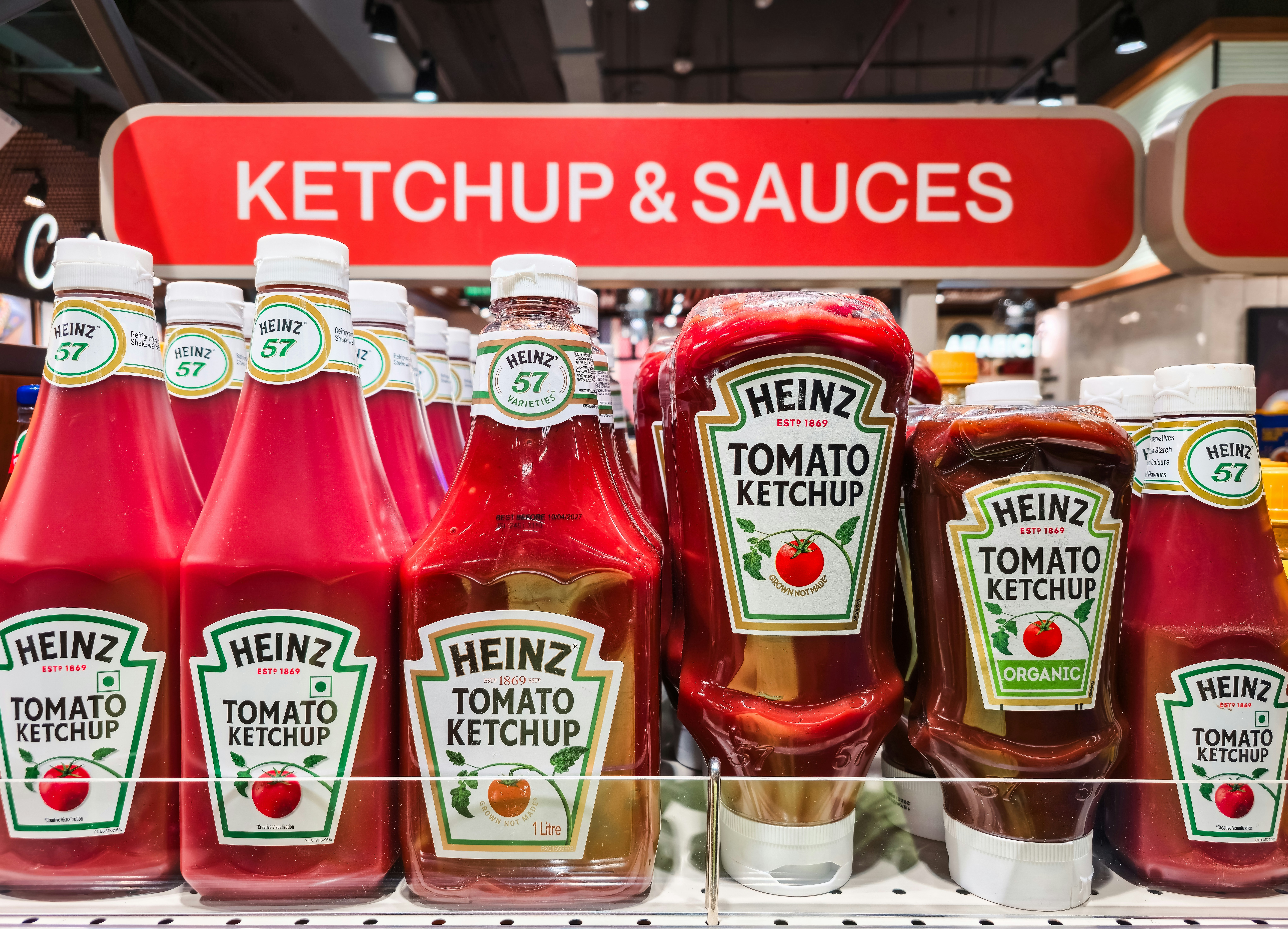 Central Ketchup Aisle: Bold Reds under a Bright Sign