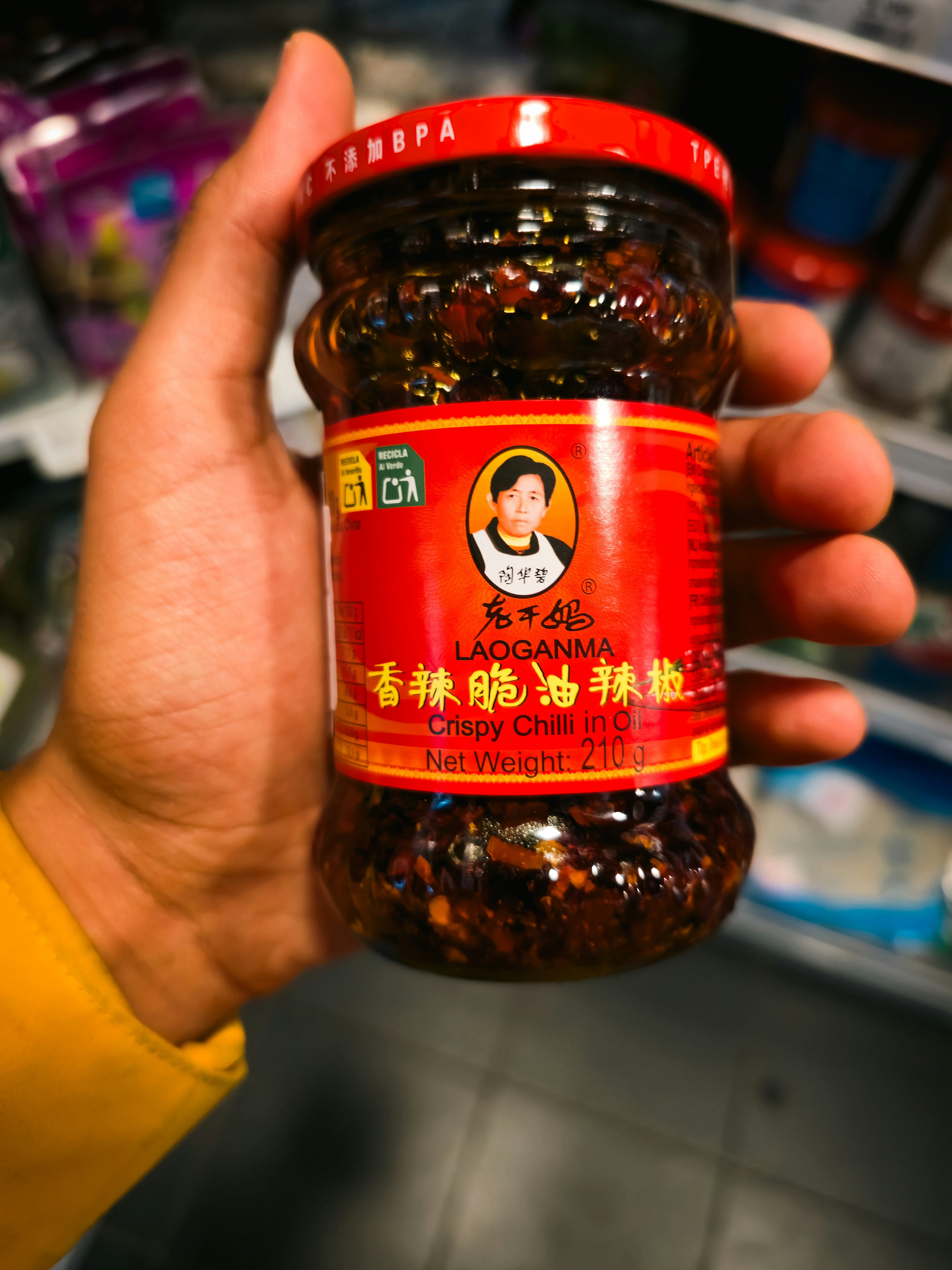 Crimson Jar of Fiery Crunch in Hand