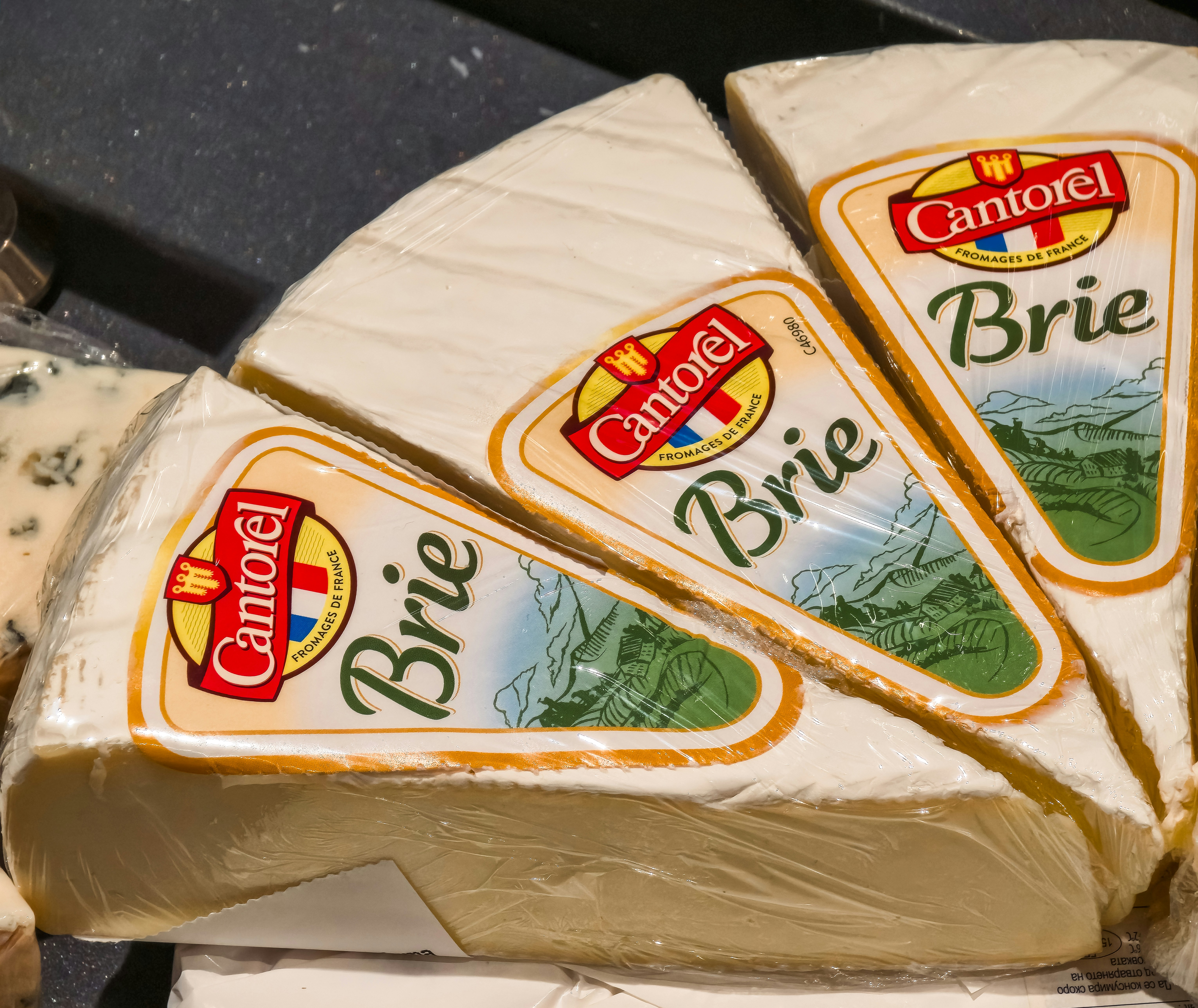 Wheel of Brie: A Triad of Wedges Nestled on the Counter