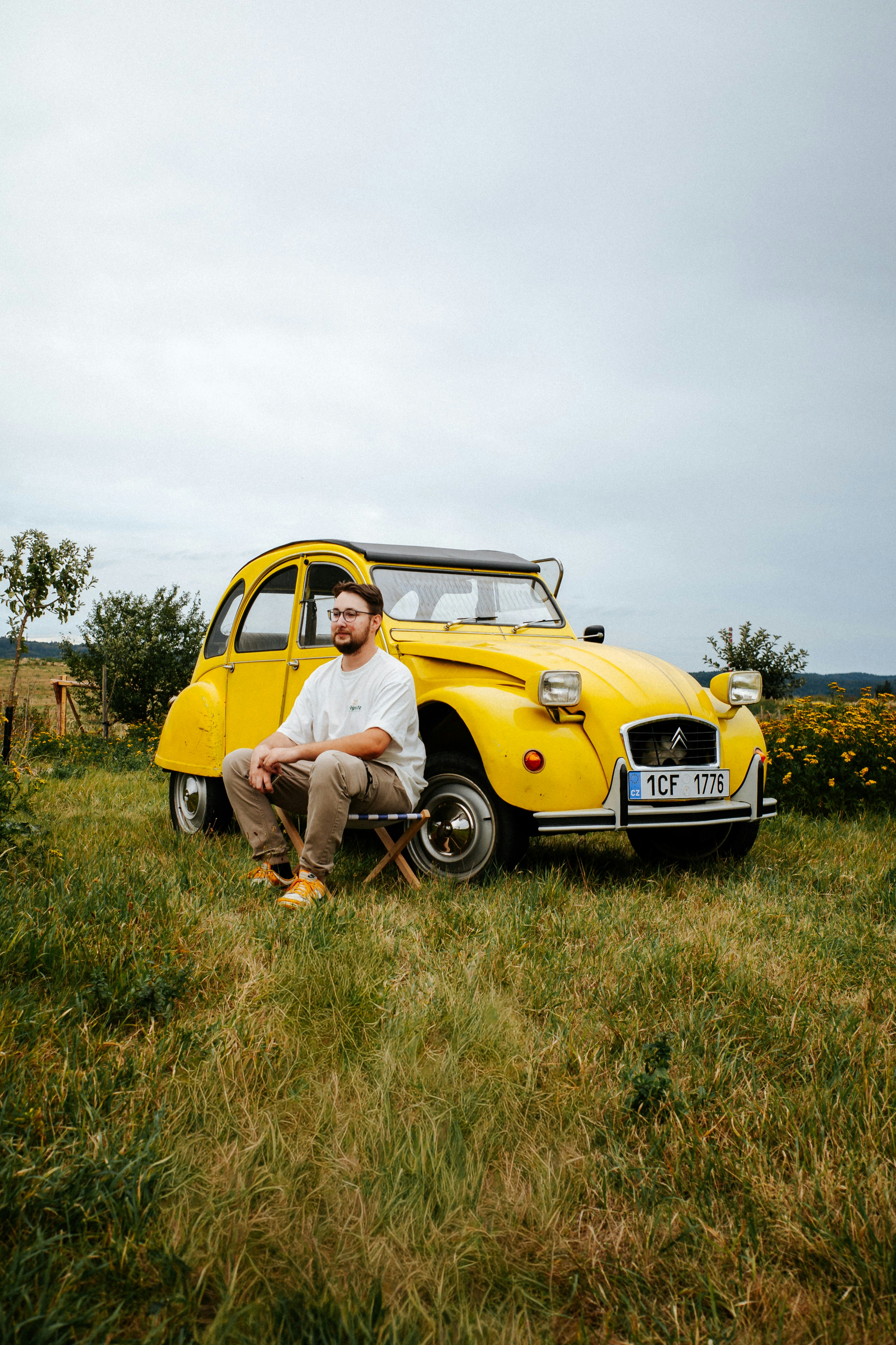 Yellow Citroën Retreat: A Quiet Moment with a Man and a Classic Car