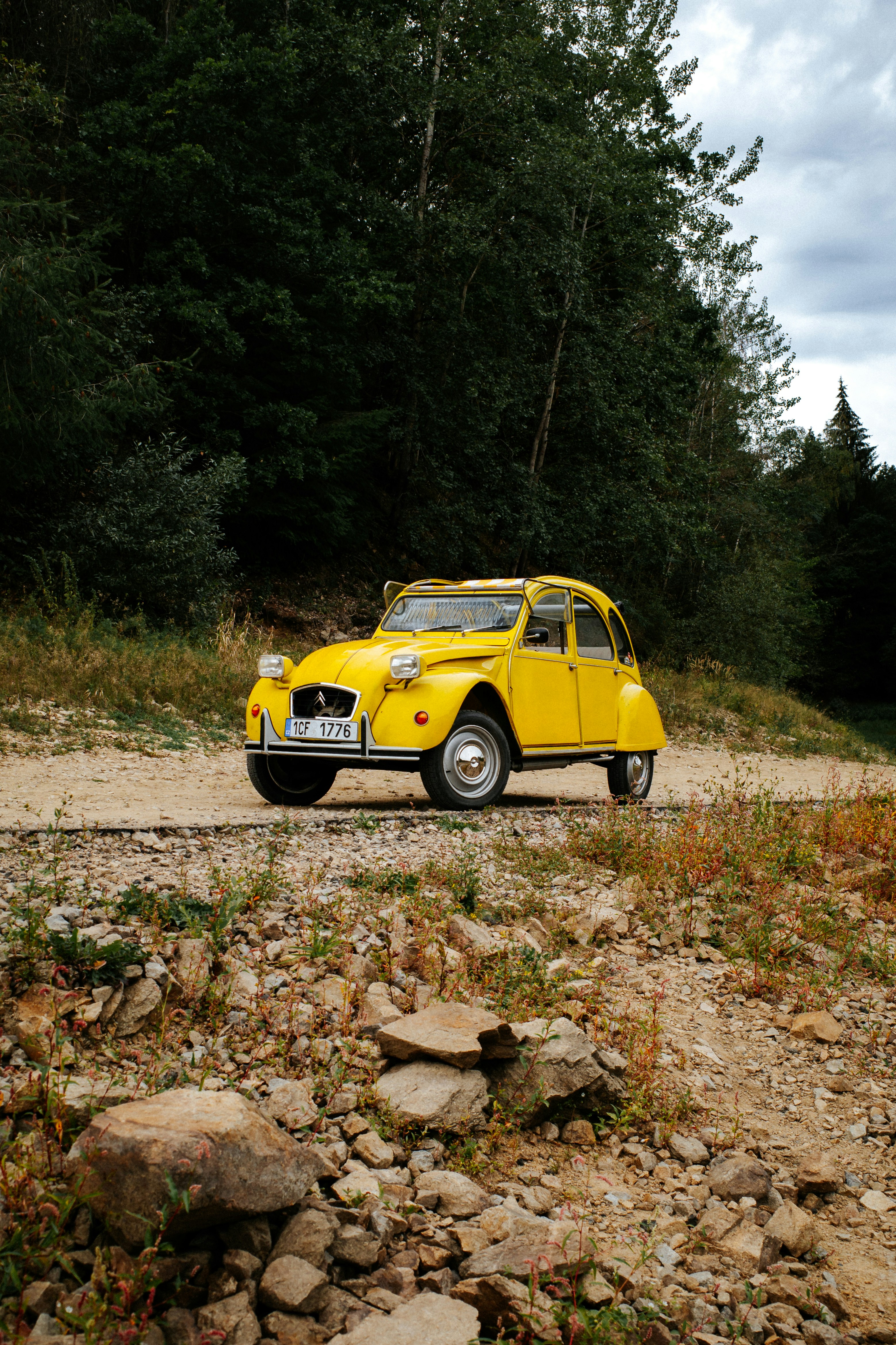 Yellow Citroën on a Rocky Path