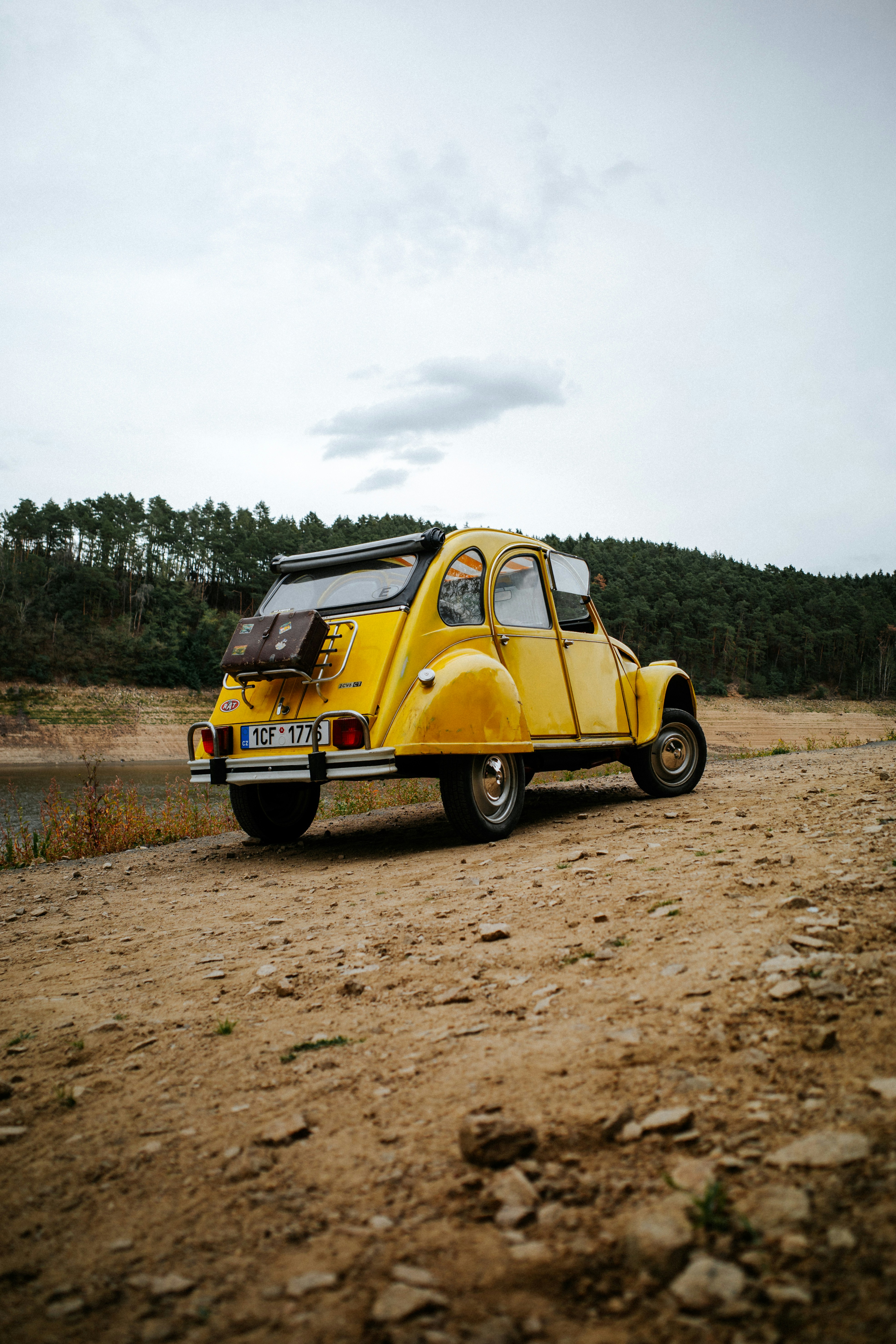 Yellow Citroen-booted Surveyor: A Rustic Ride Across Rough Terrain
