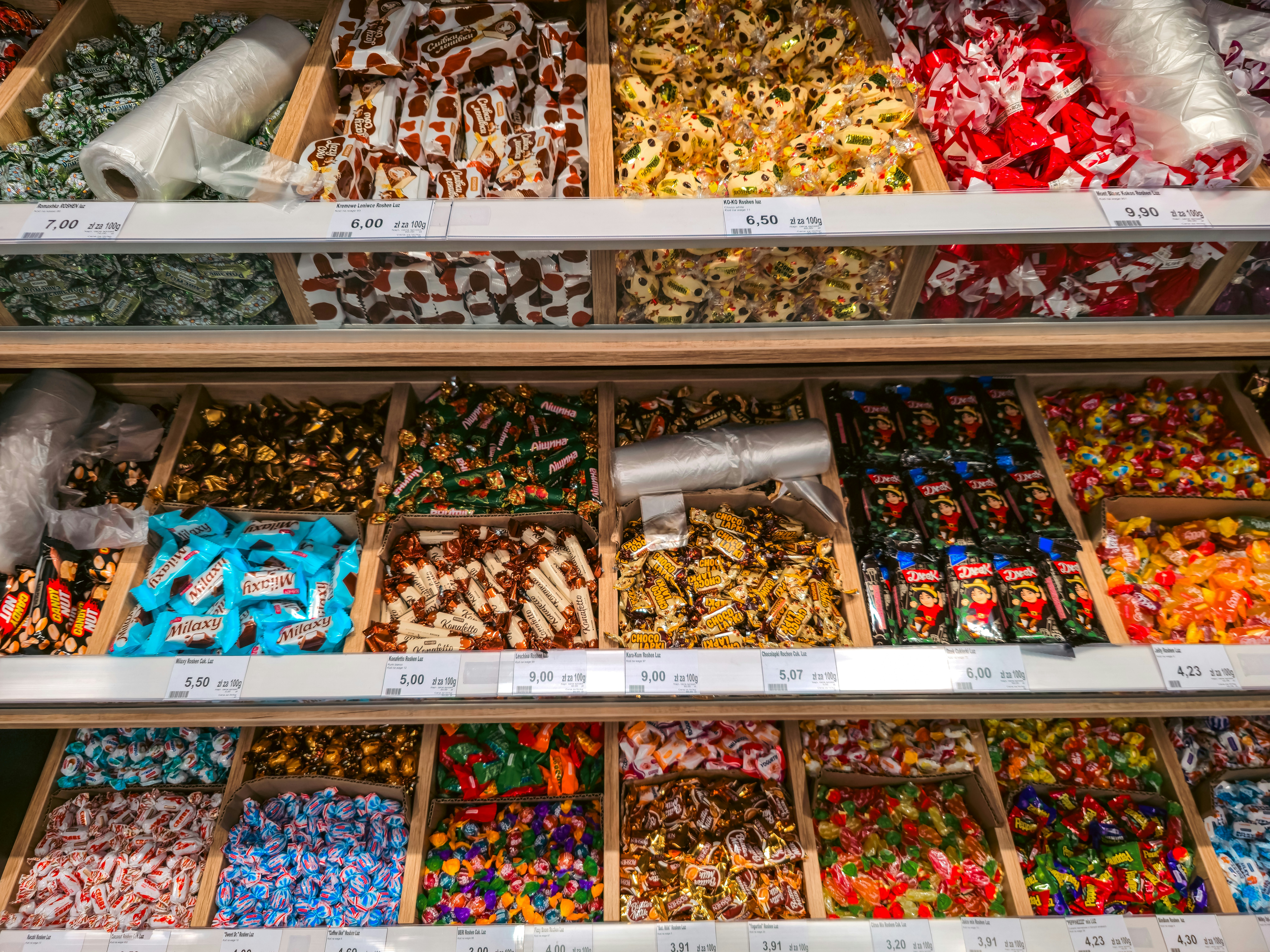 Candy Aisle Cross-Section: Colorful Treasures in Wooden Bins