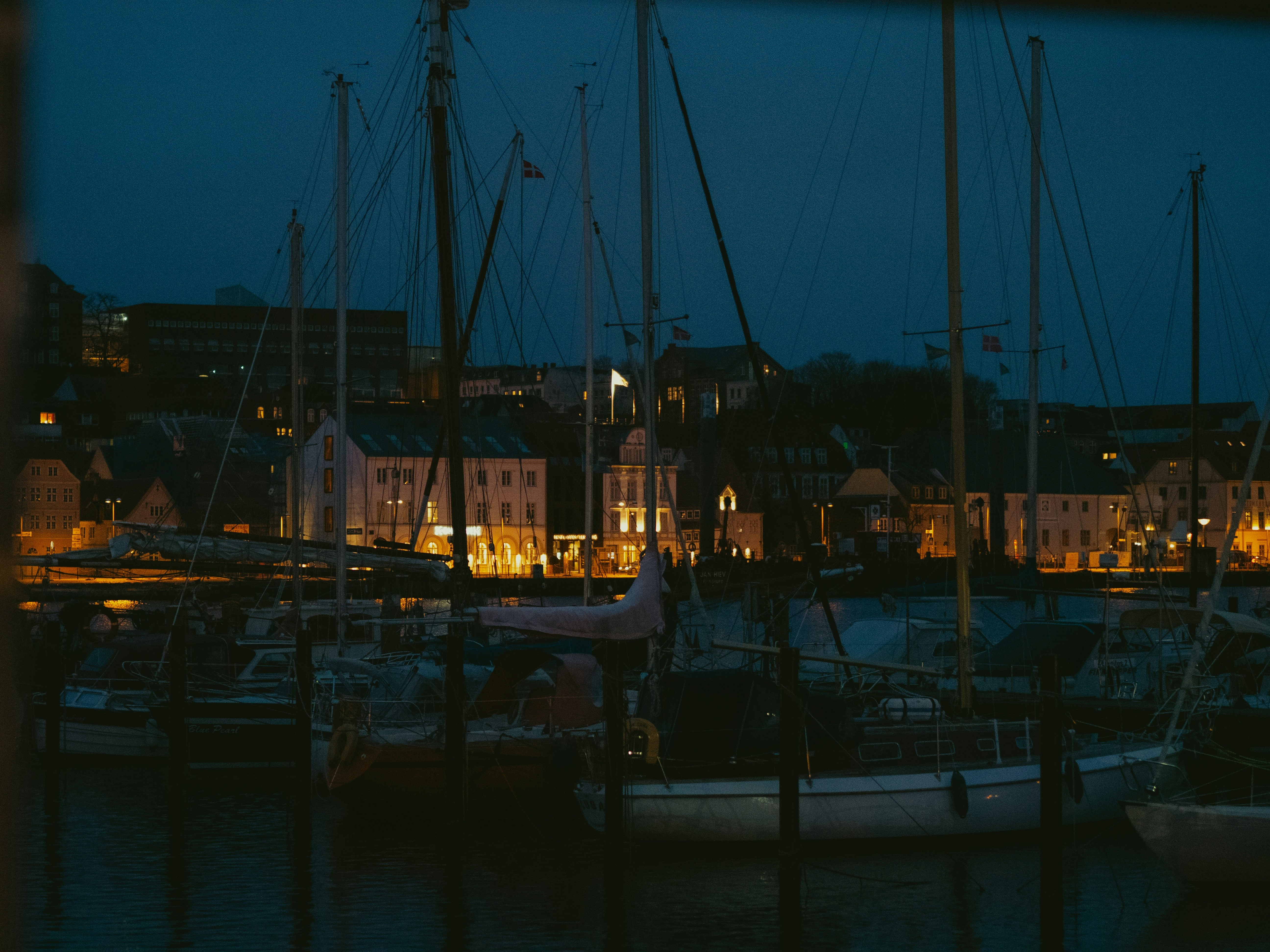 Quiet Tide, Neon Town: Boats and Lights After Sundown
