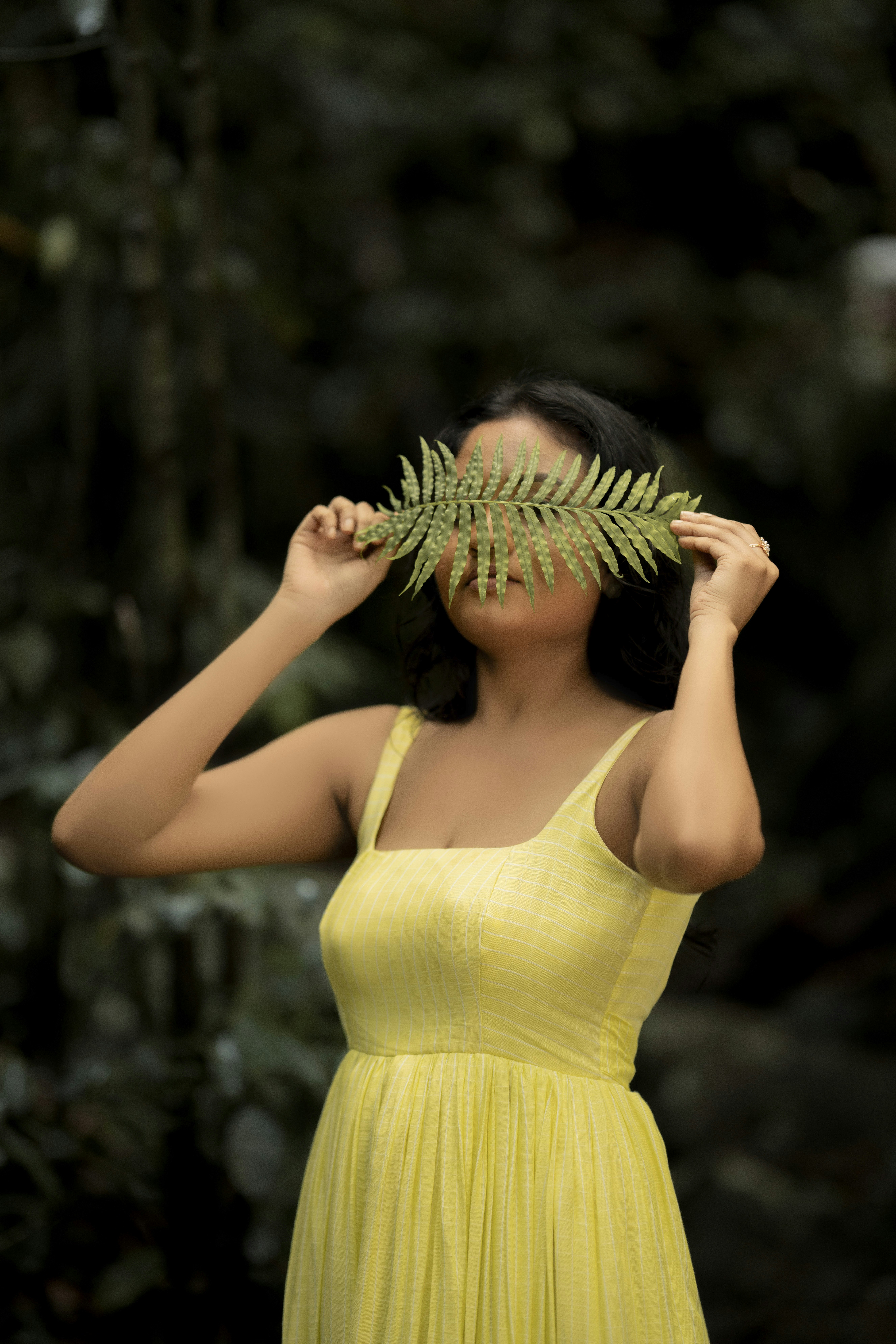 Yellow Dress, Green Fern, and Hidden Smile