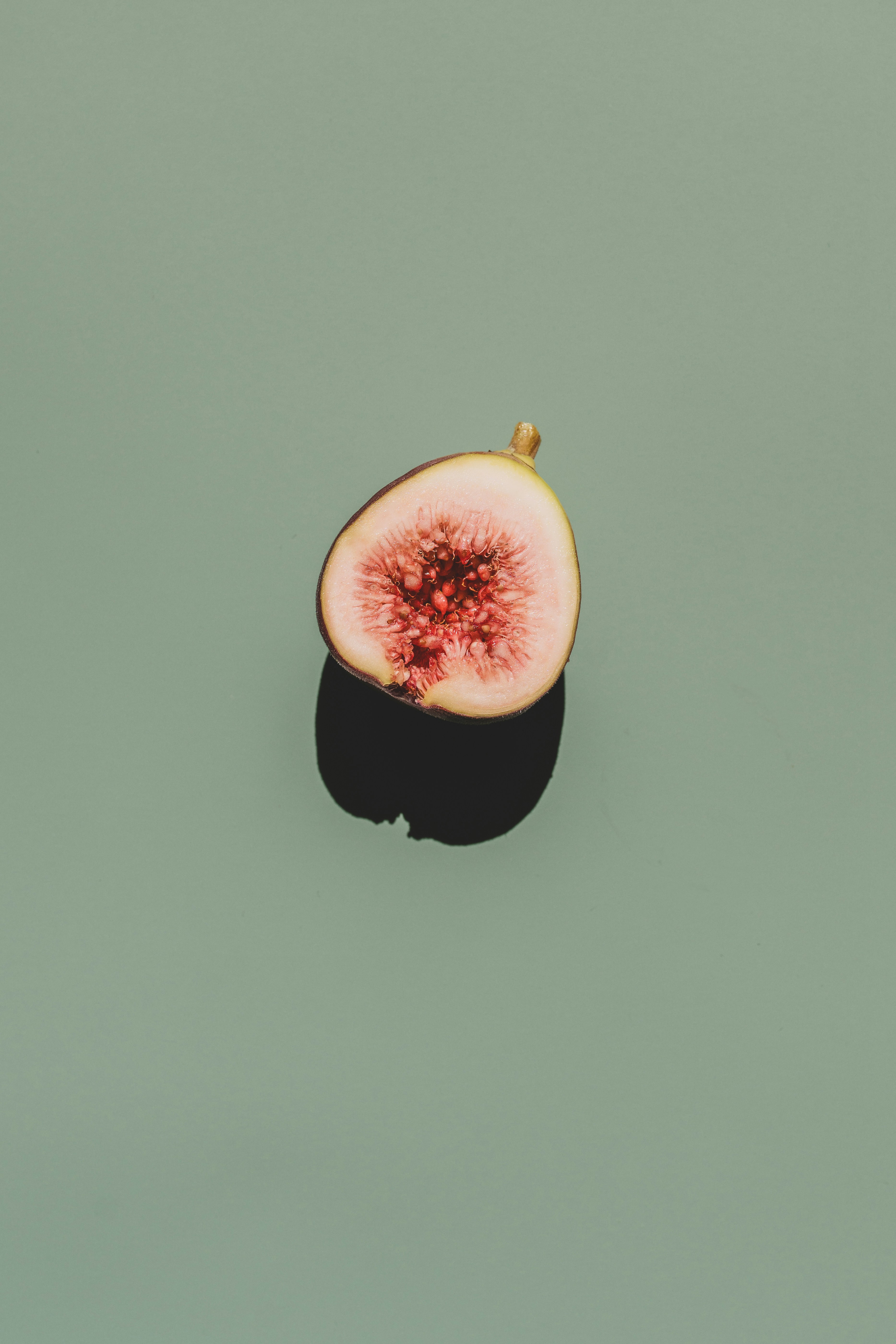 Slice of Summer: A Figscented Halved Fruit on Sage