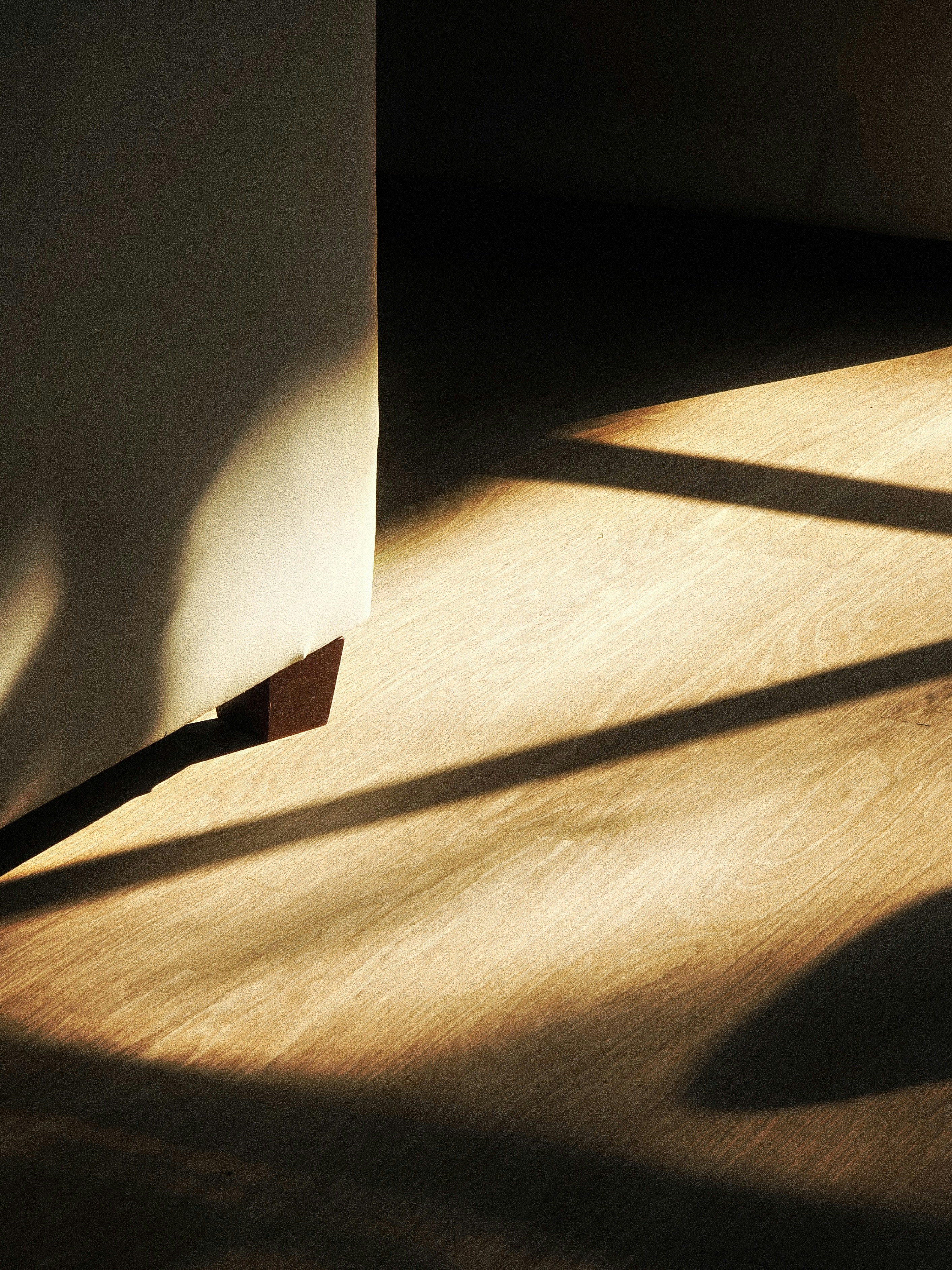 Sunlit Stripes: A Quiet Corner of Shadow and Wood