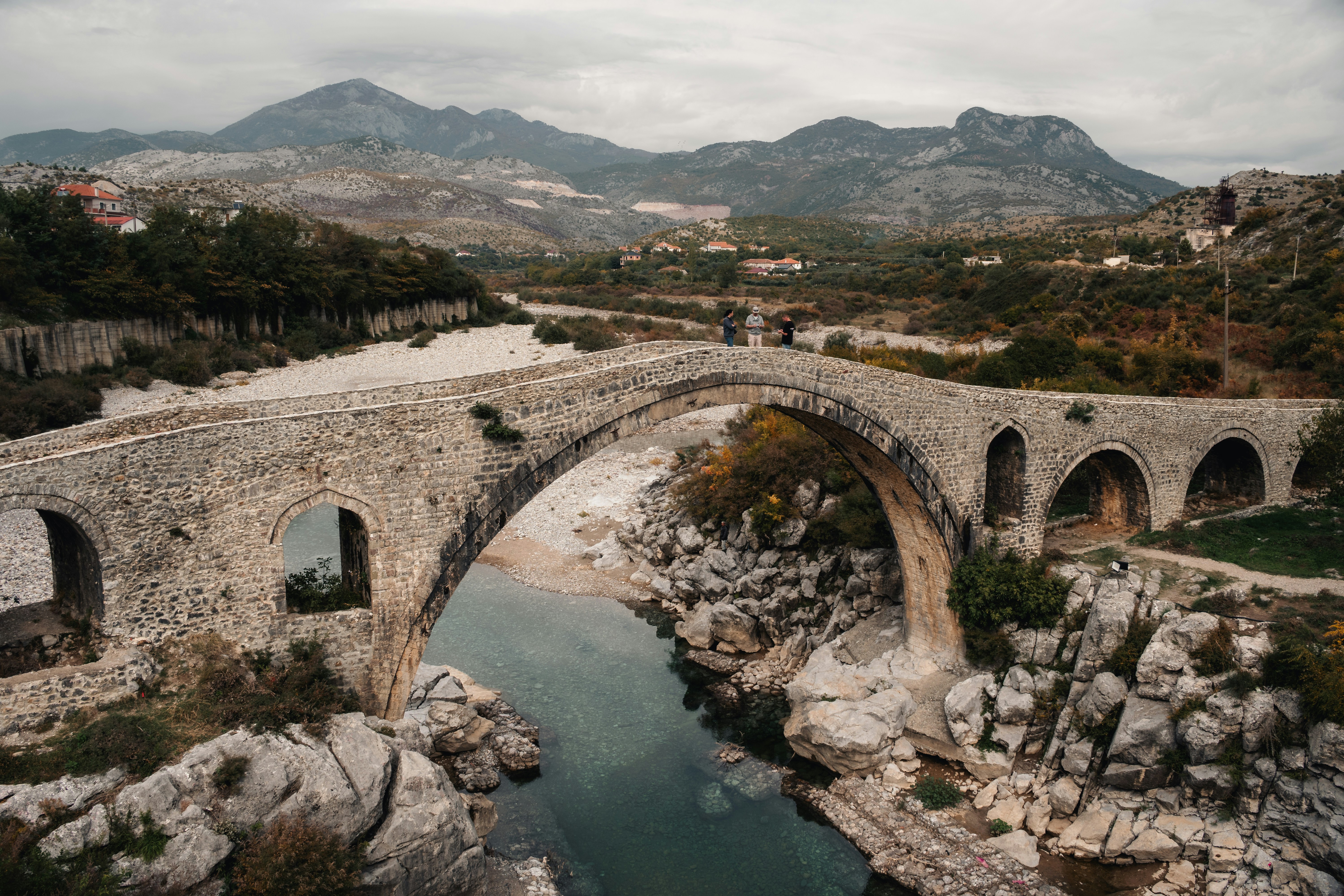 Ancient Stone Archway over a Turquoise River