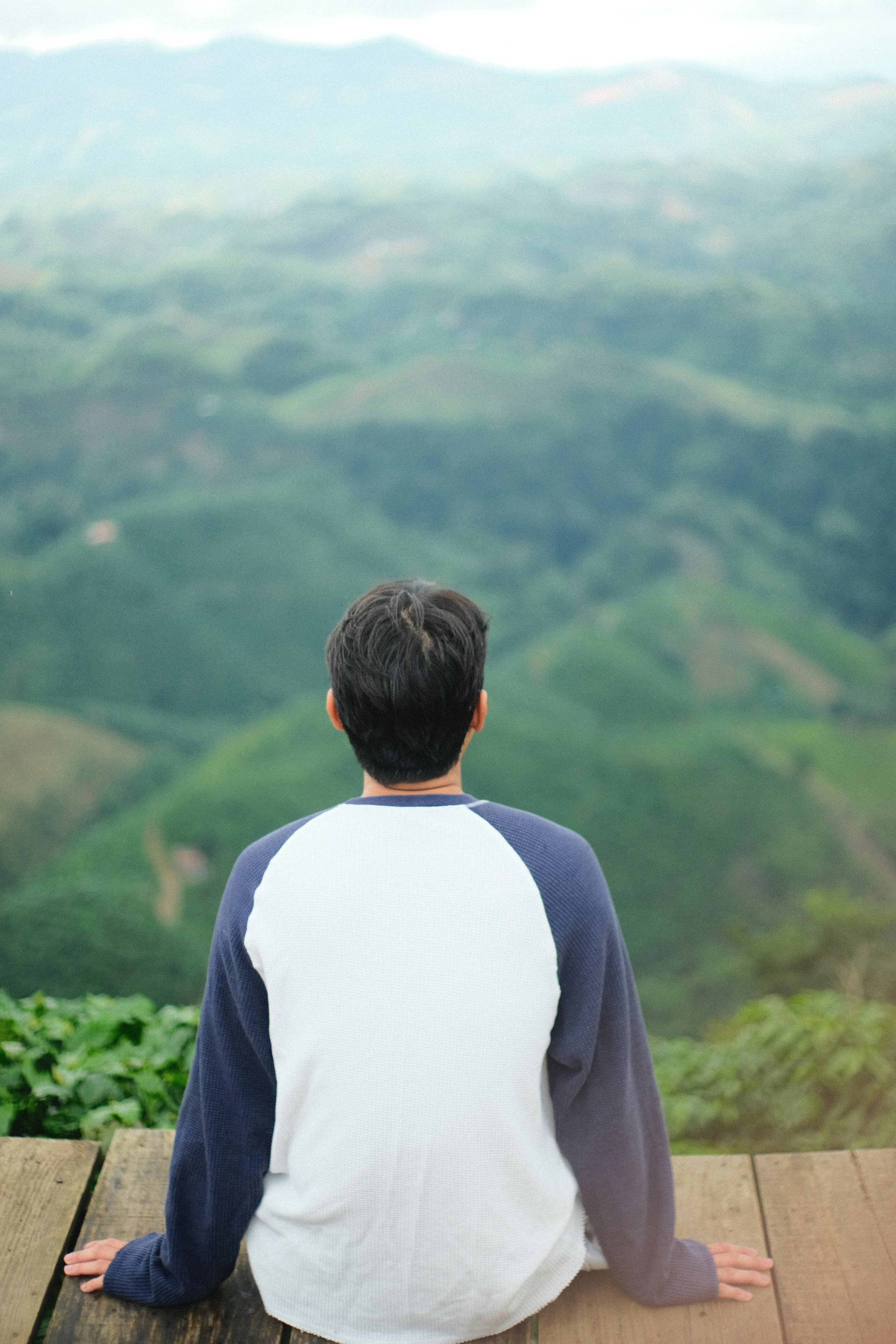 Cliffside Quiet: A Perspective from Behind a Seated Observer