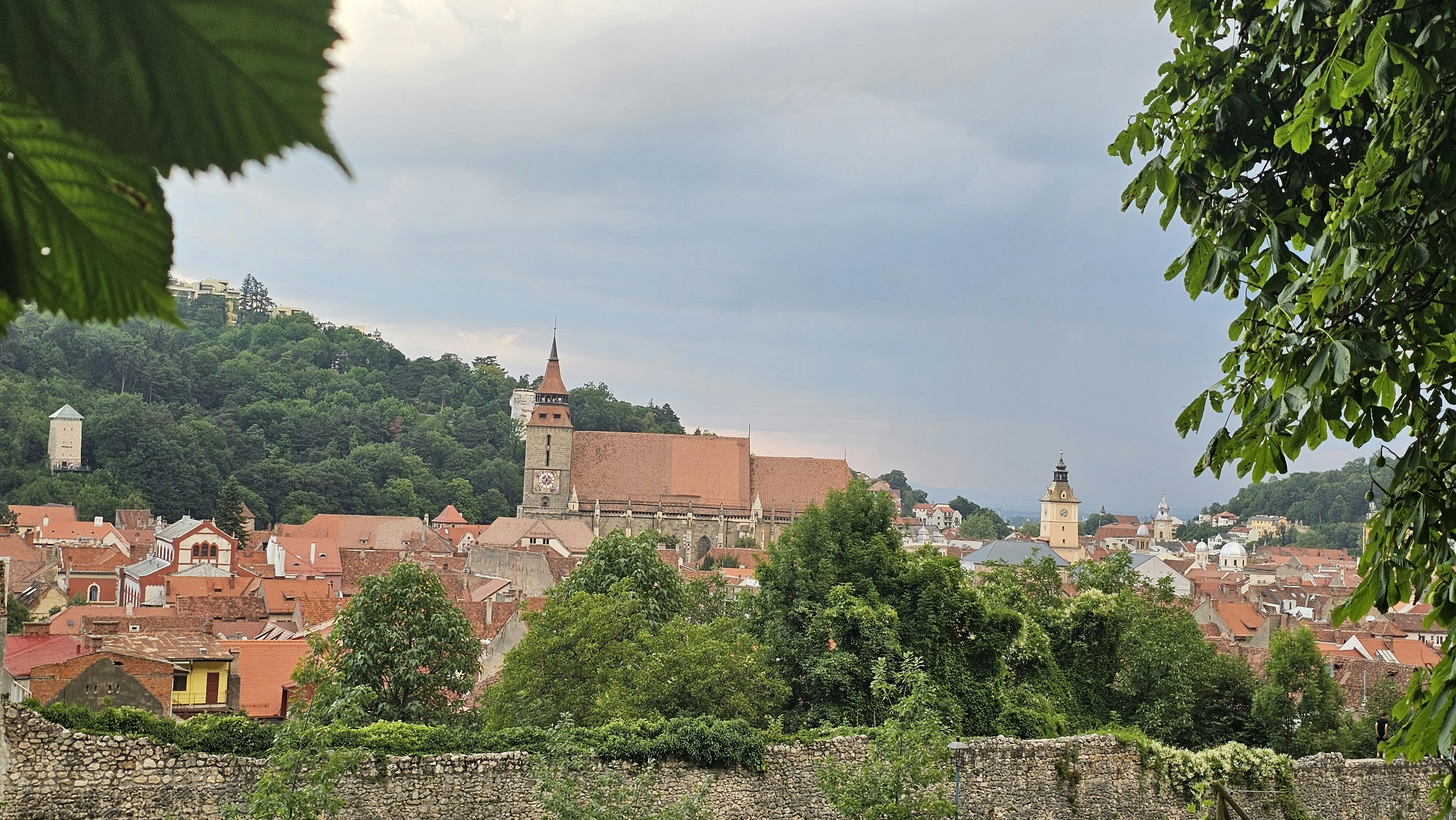 Amber Rooftops and Clocktower: A Czech Town in Evening Light