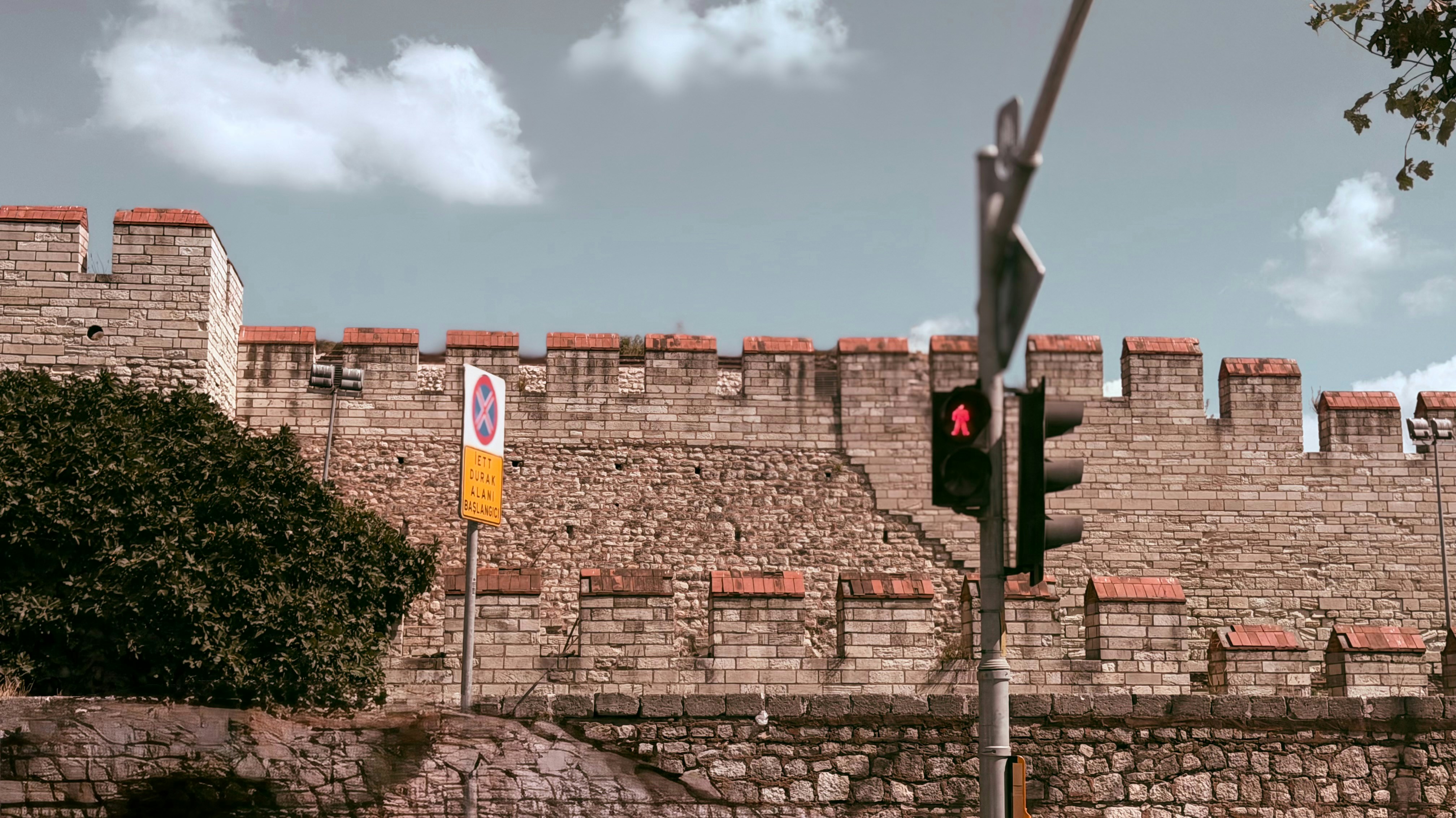 Fortress Echoes: A Street Corner Framed by Ancient Walls