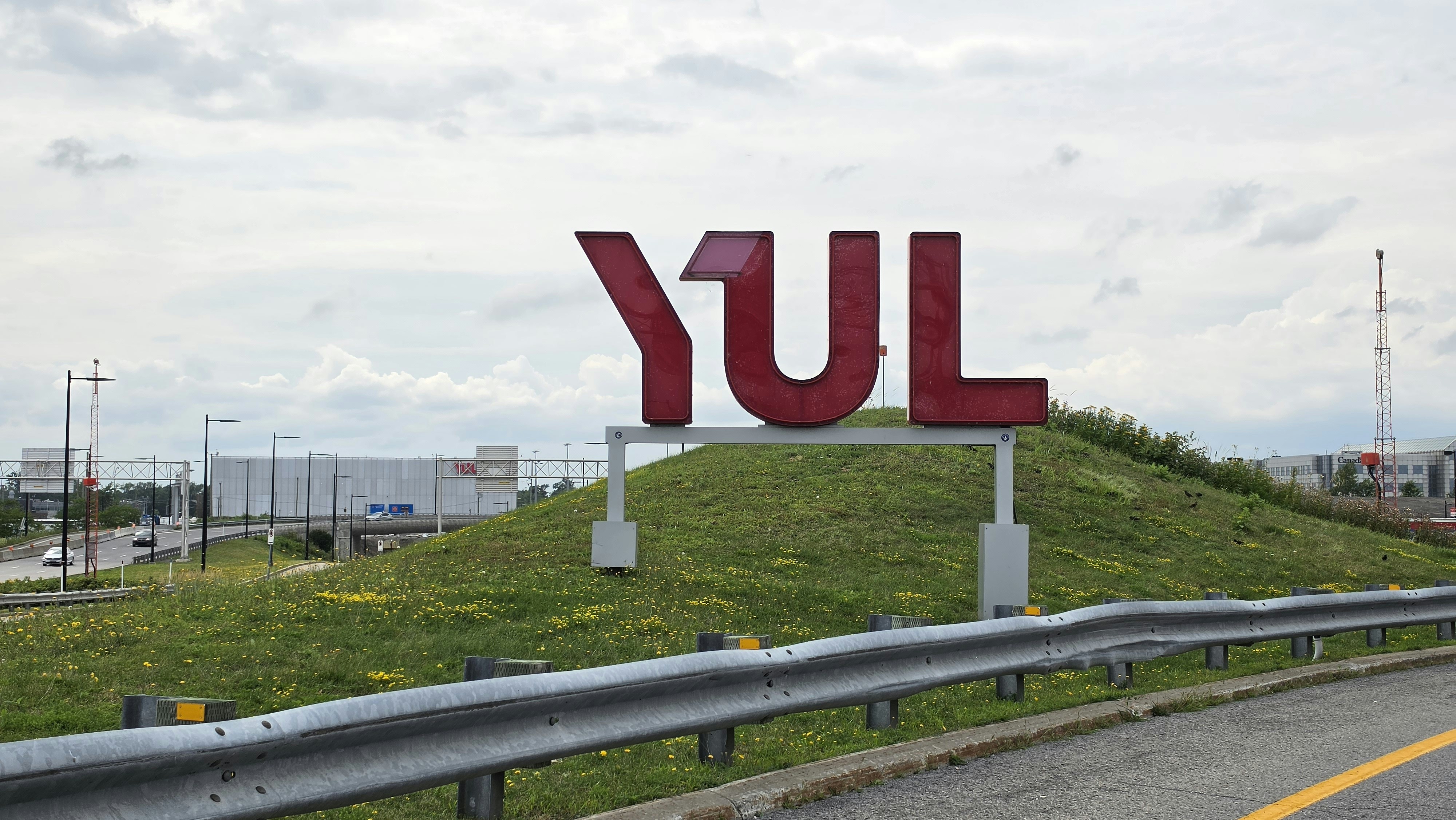 YUL Landmark on the Hill: Bold Red Letters Above the Highway