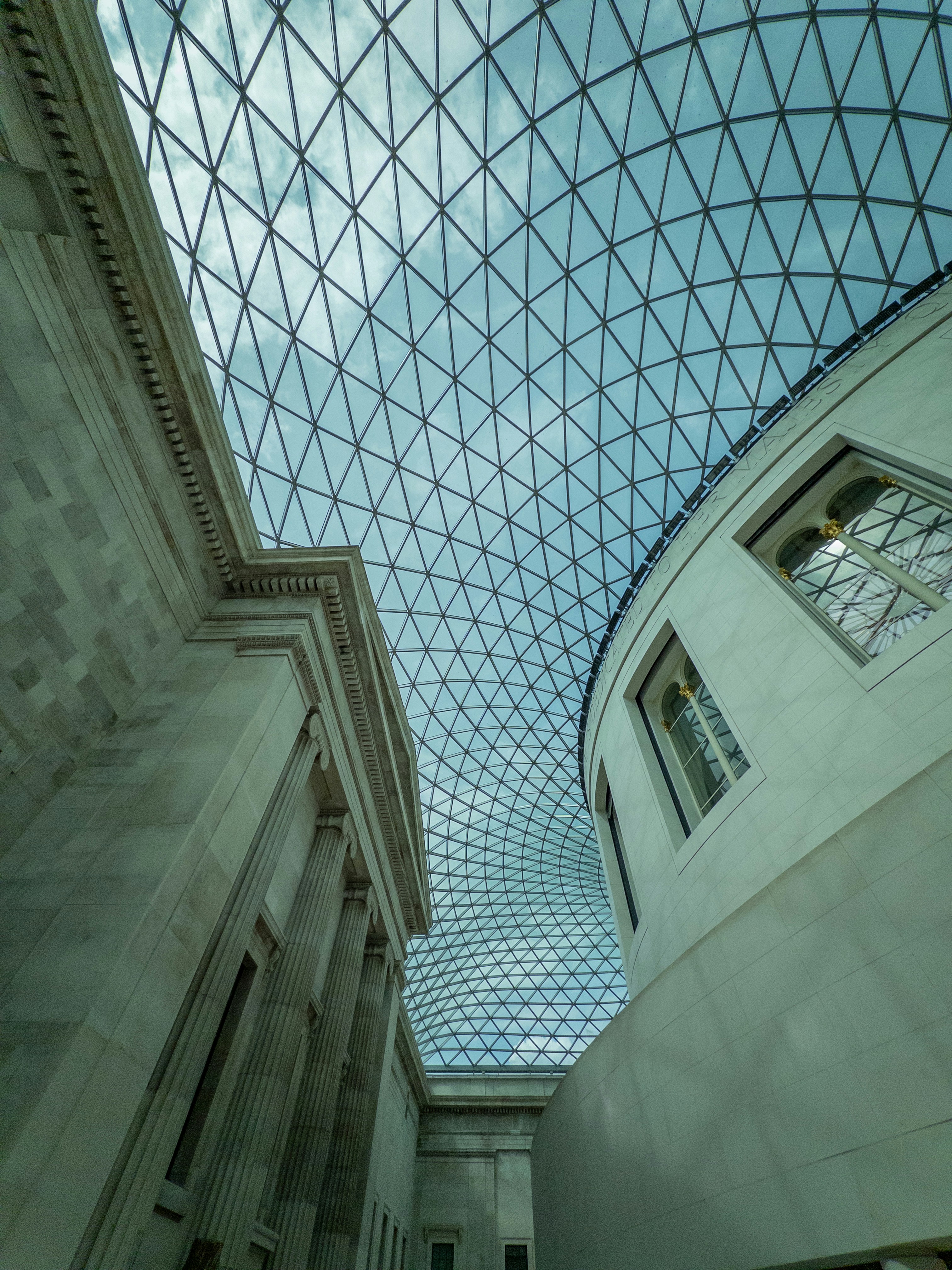 Glass-Vaulted Atrium: Geometry Meeting Stone