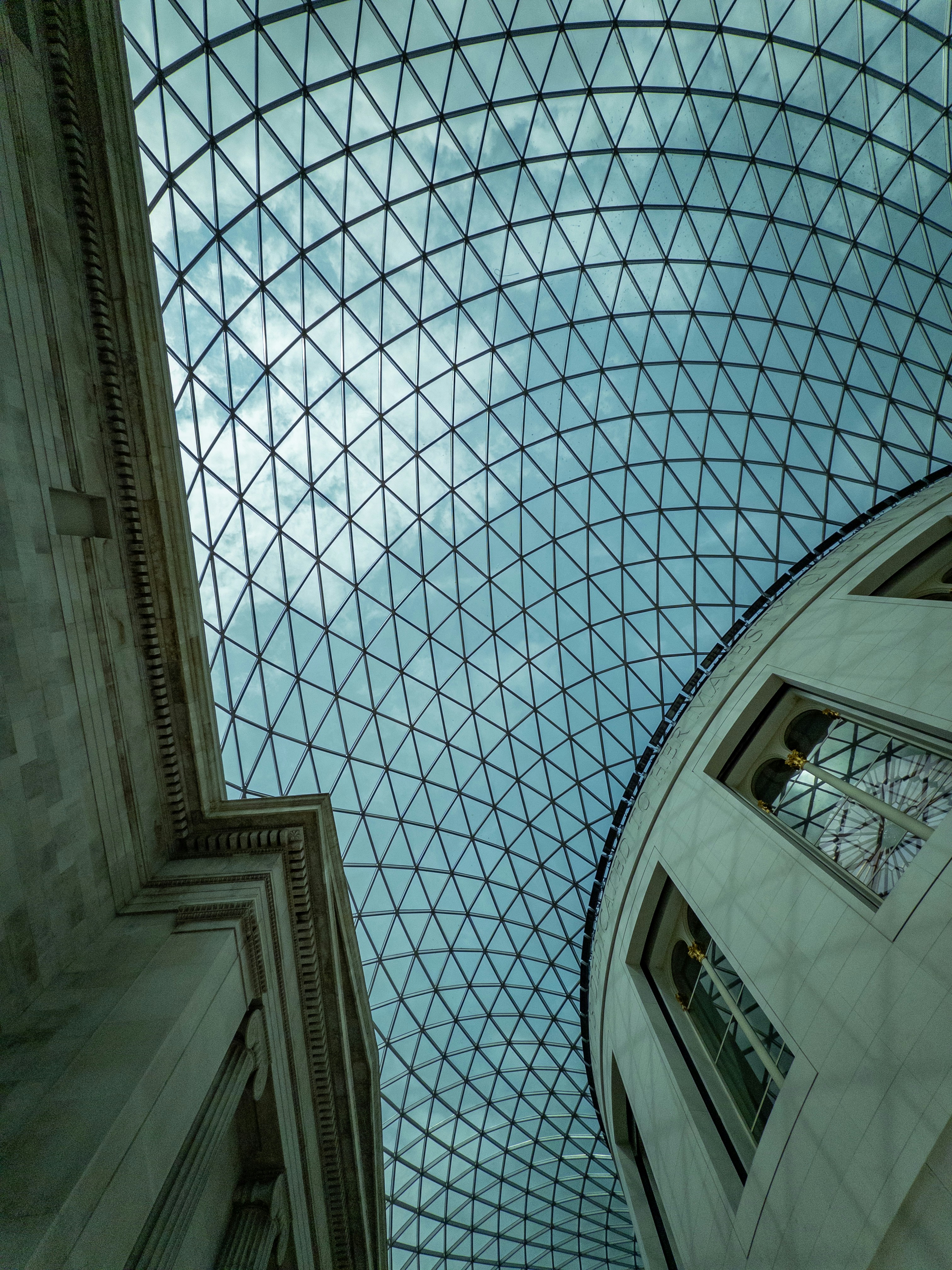 Glass-tiled vault overhead: an architectural canyon of light