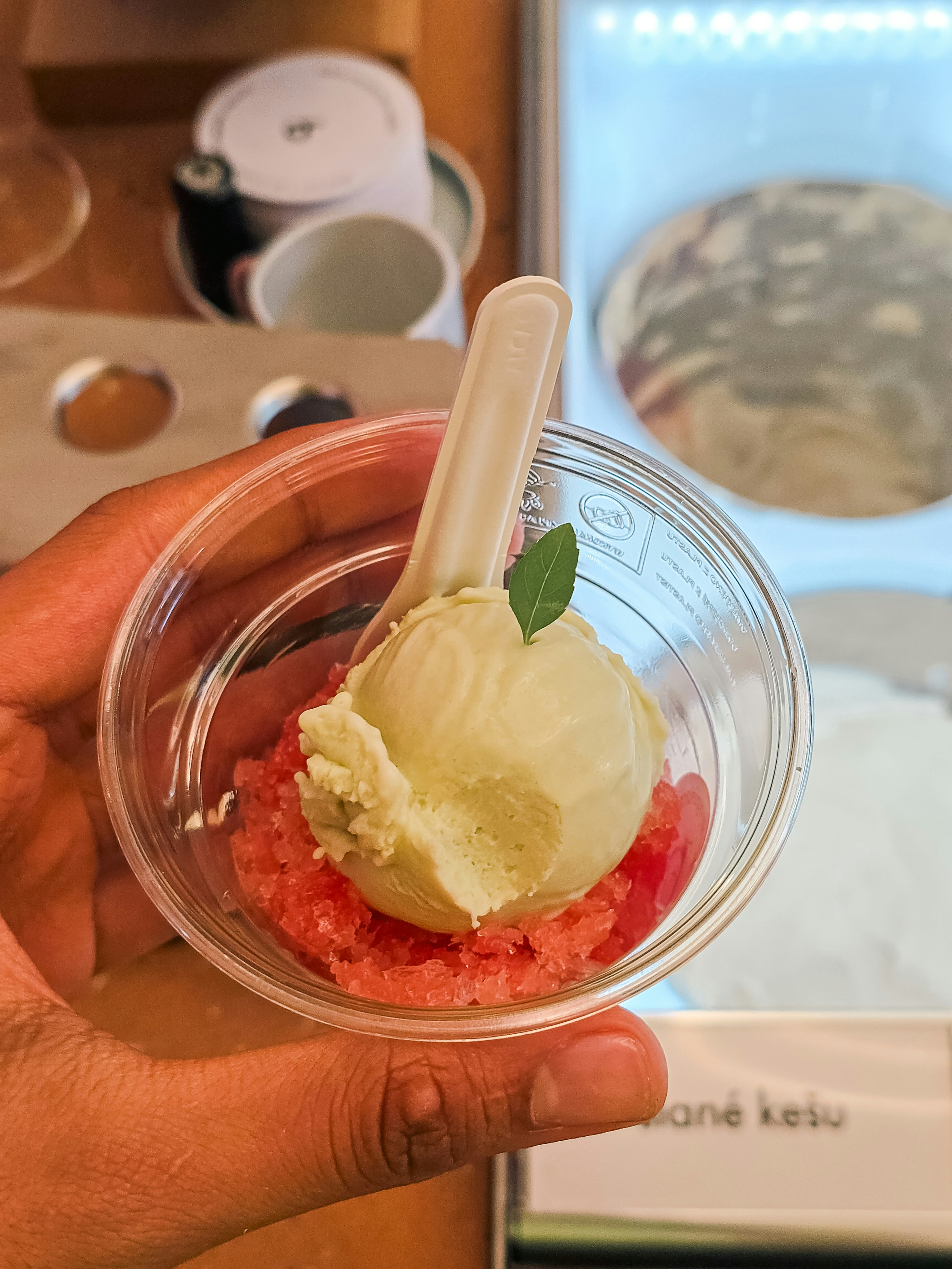 Creamy Scoops in a Clear Cup: A handheld dessert moment