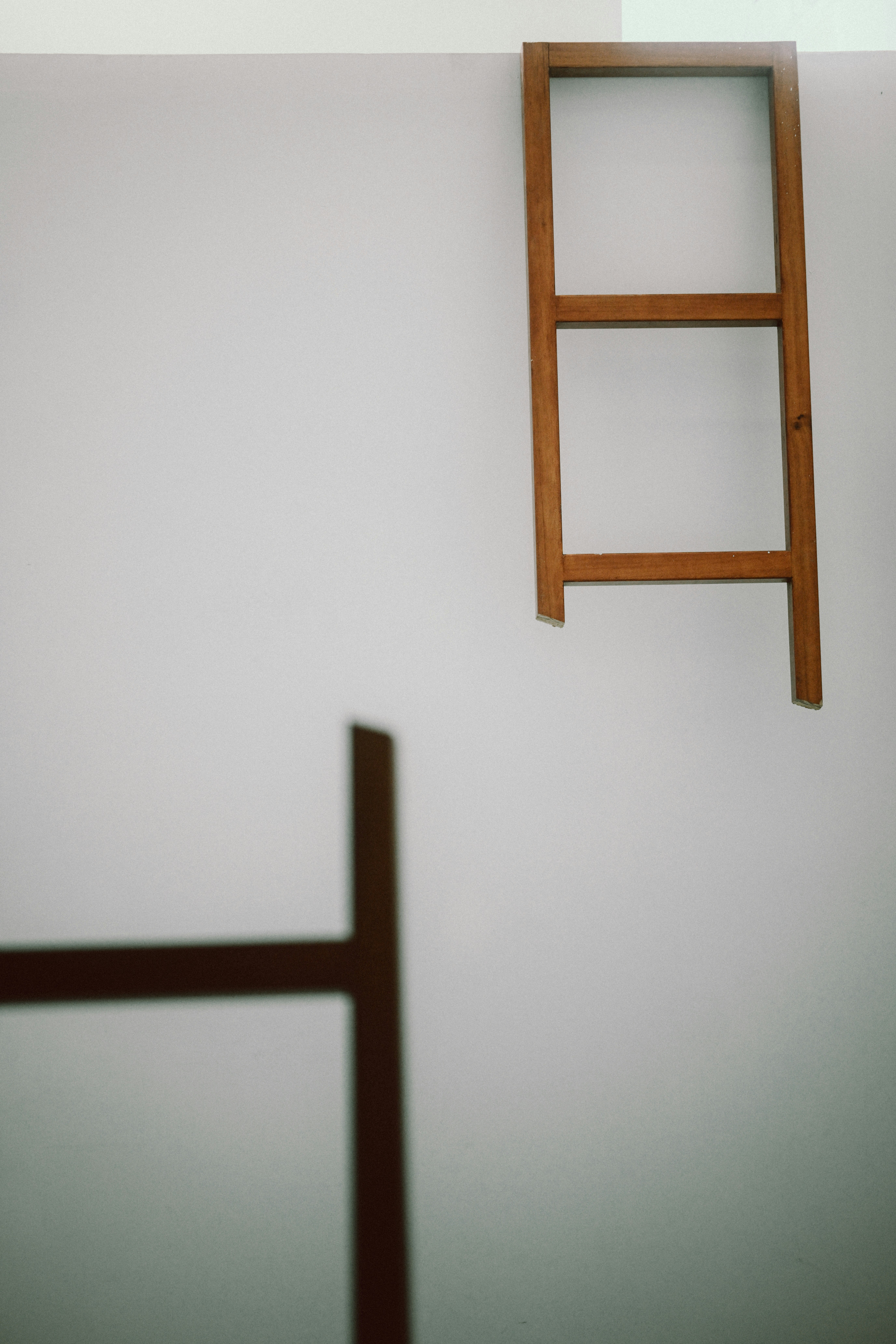Floating Frame: A Minimalist Interaction with a Wall-Maced Stool