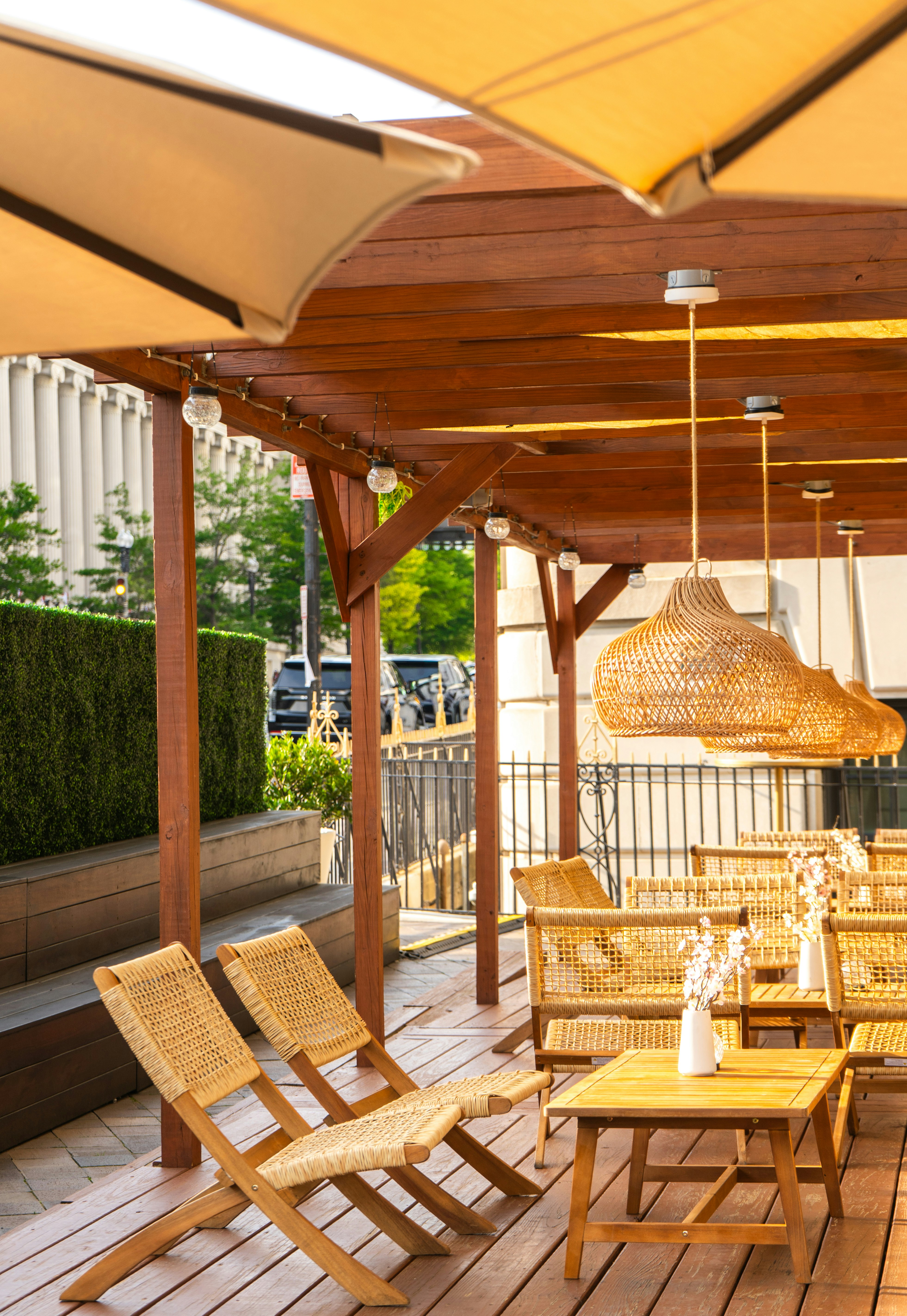 Sunlit Terrace: Rattan Lounge Under Warm Canopy