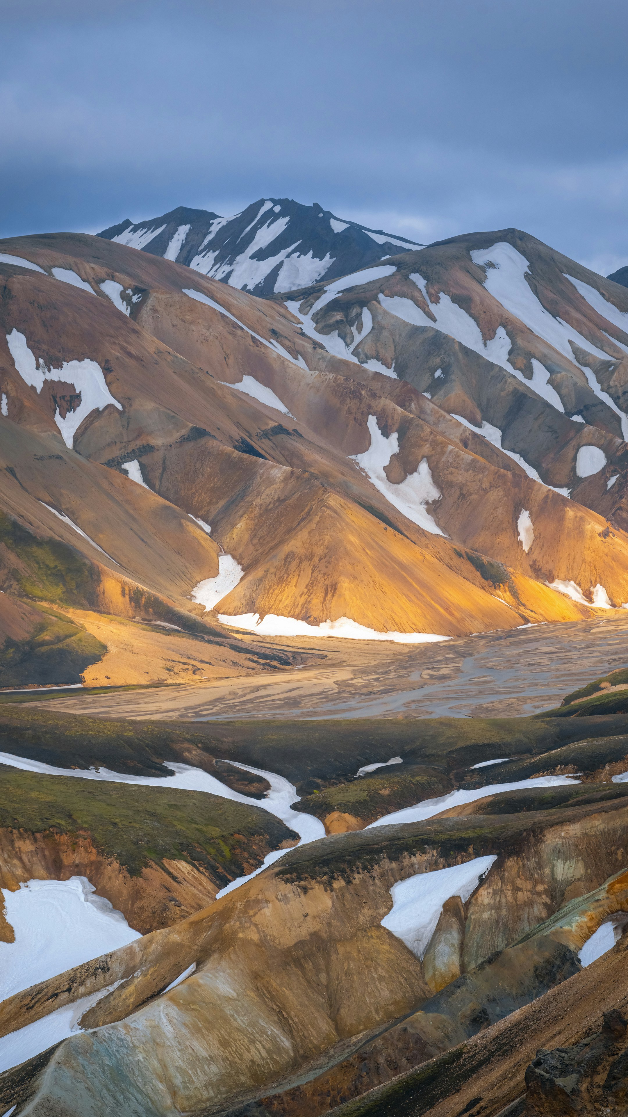 Golden Valleys Under Ice-Scarred Peaks