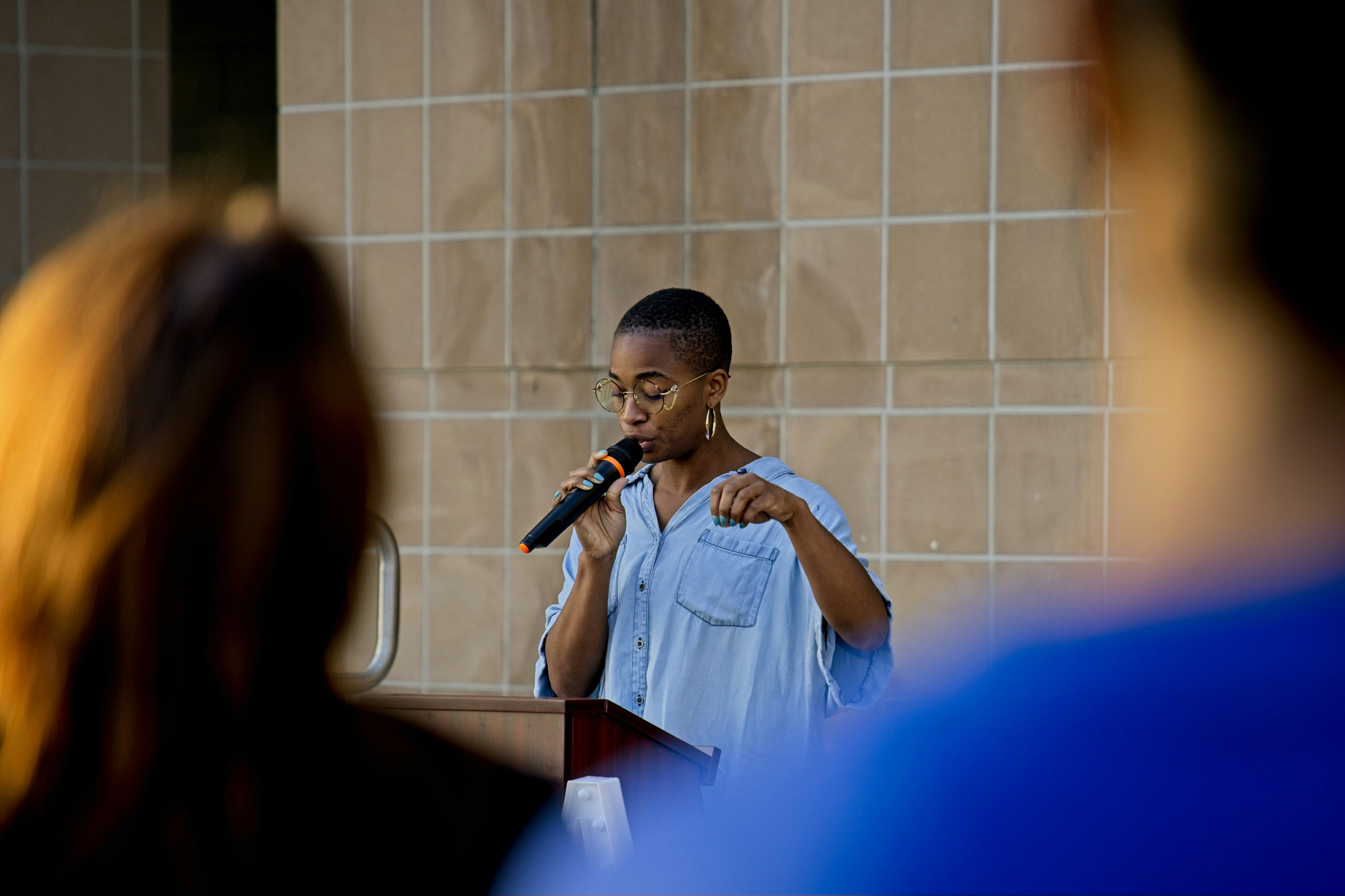 Speaker at the Podium: Intimate Moment in a Public Talk