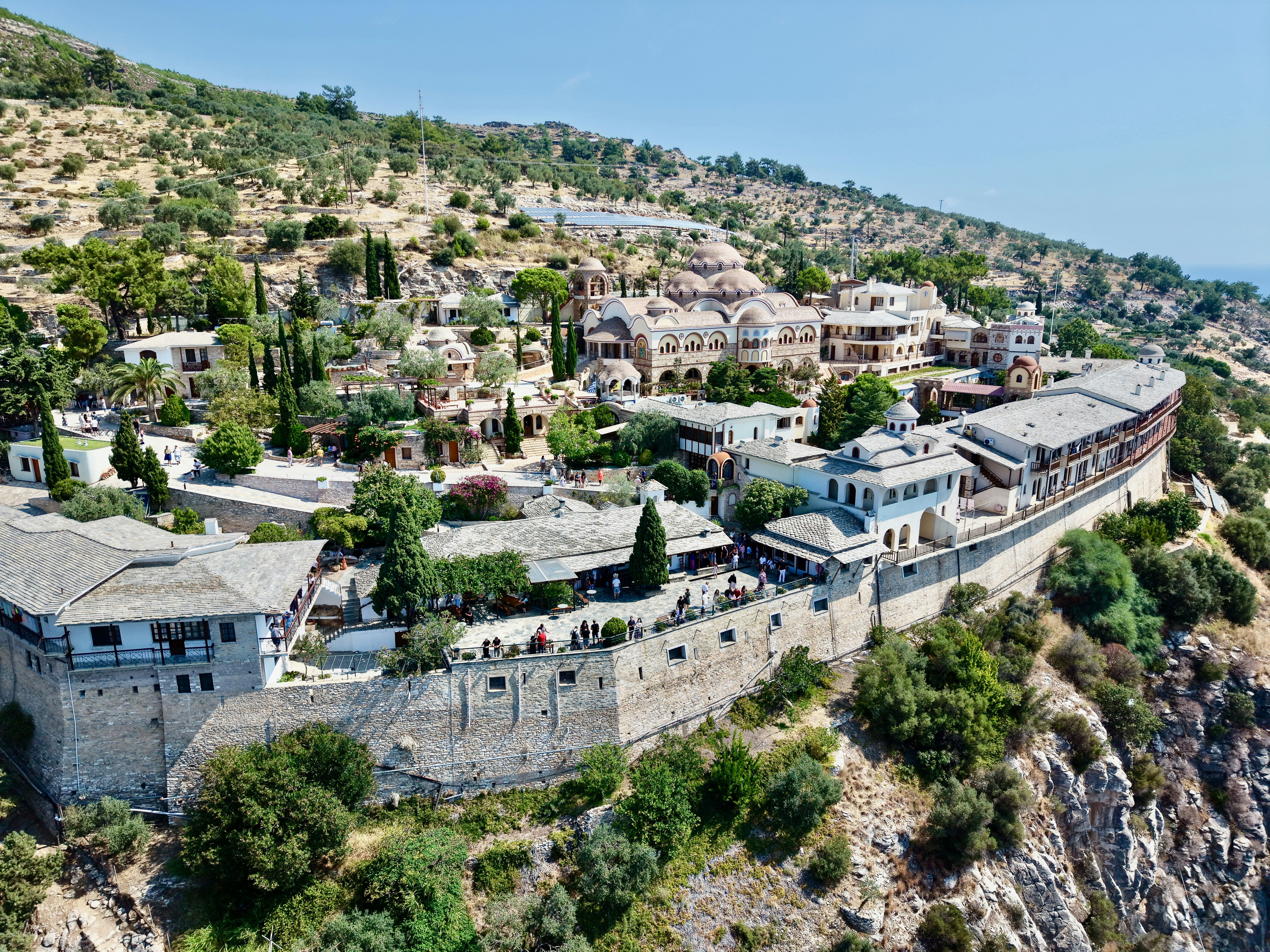  fortress village stitched on a sunlit hillside