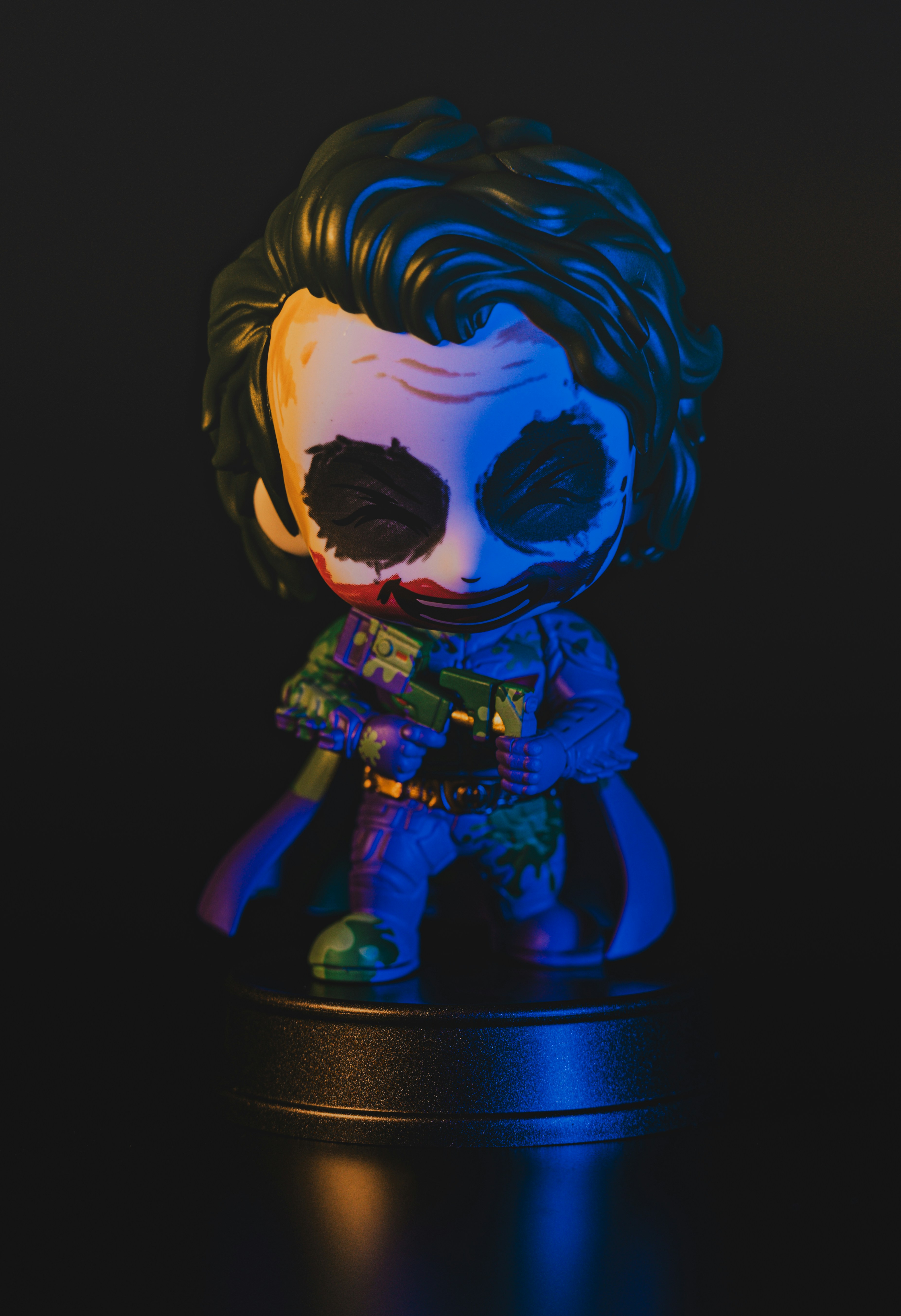 Miniature Joker: Neon Shadows in a Dark Studio