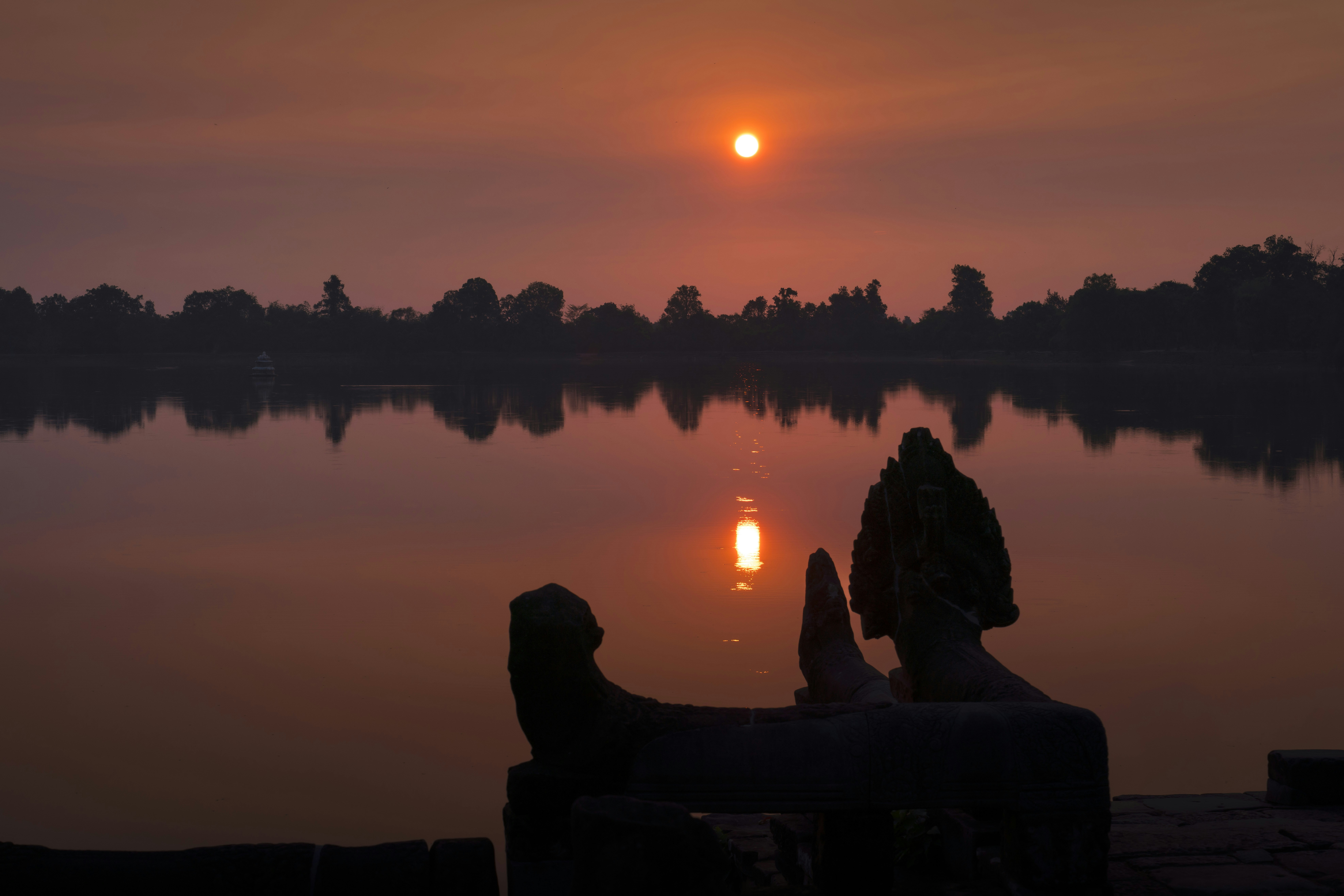 Silhouette at Dusk: A Quiet Dock Gaze Toward the Glowing Horizon