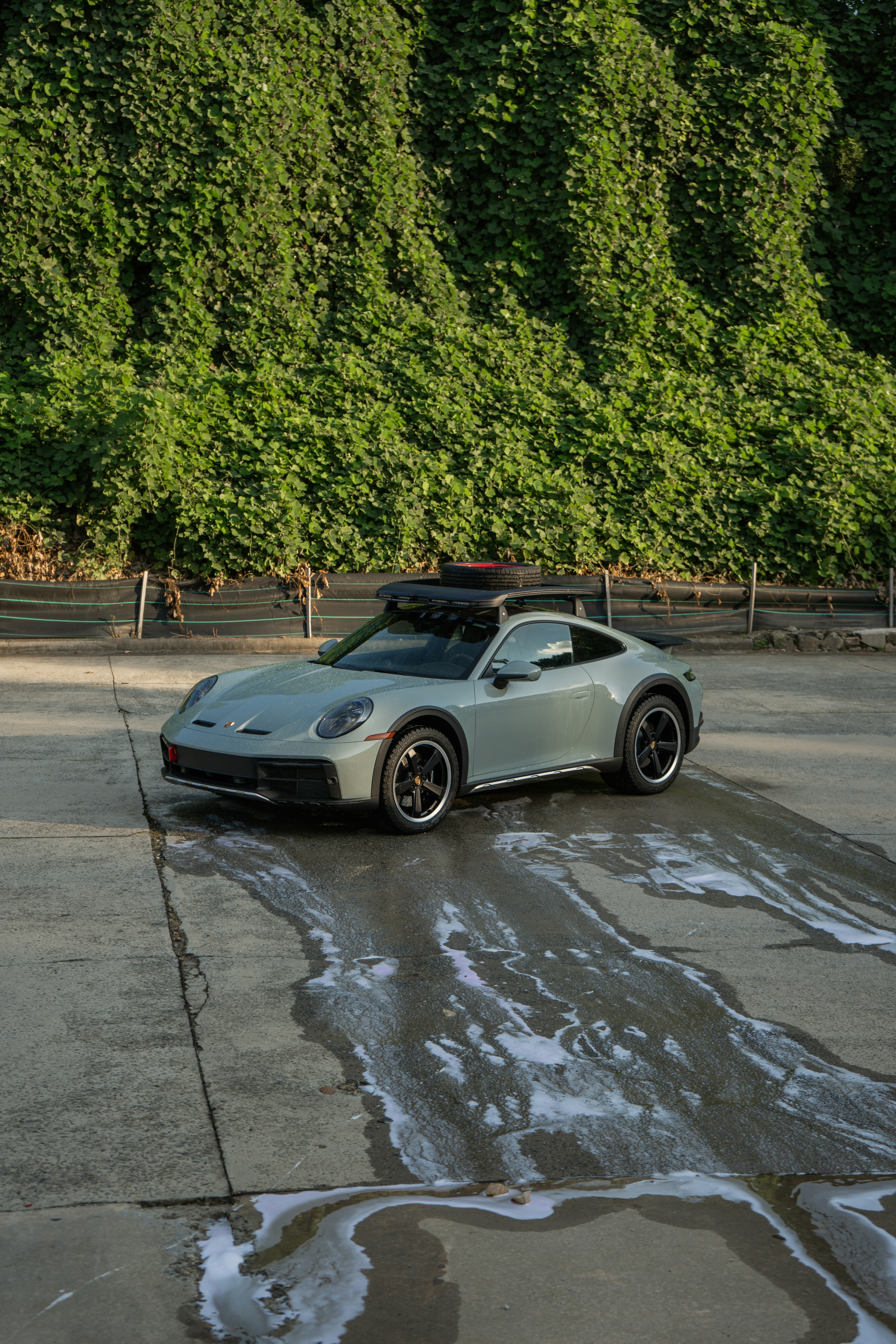 Sleek Porsche in a Quiet Car-Wash Moment