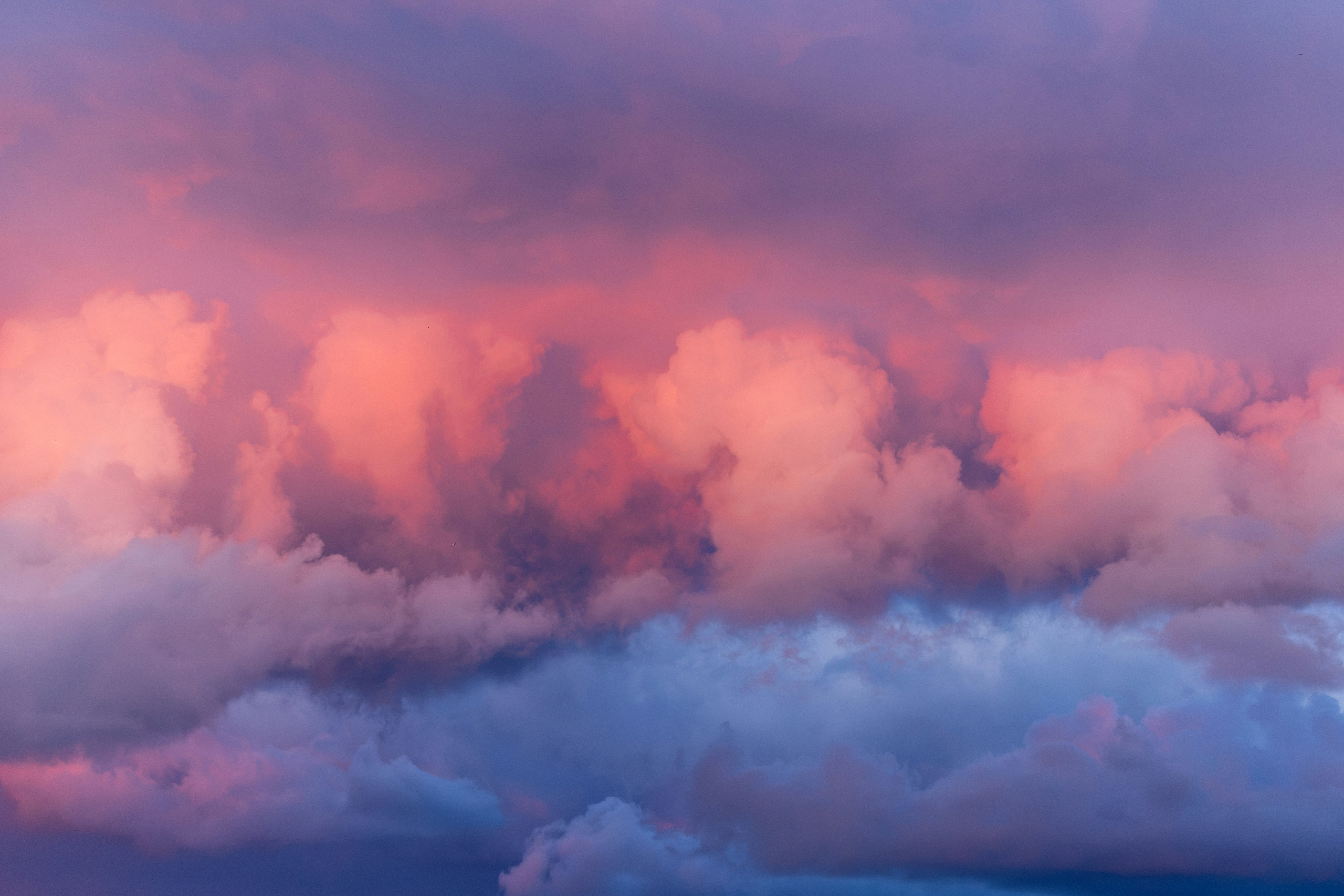 Sunset-tinged Cloudscape Over a Quiet Horizon