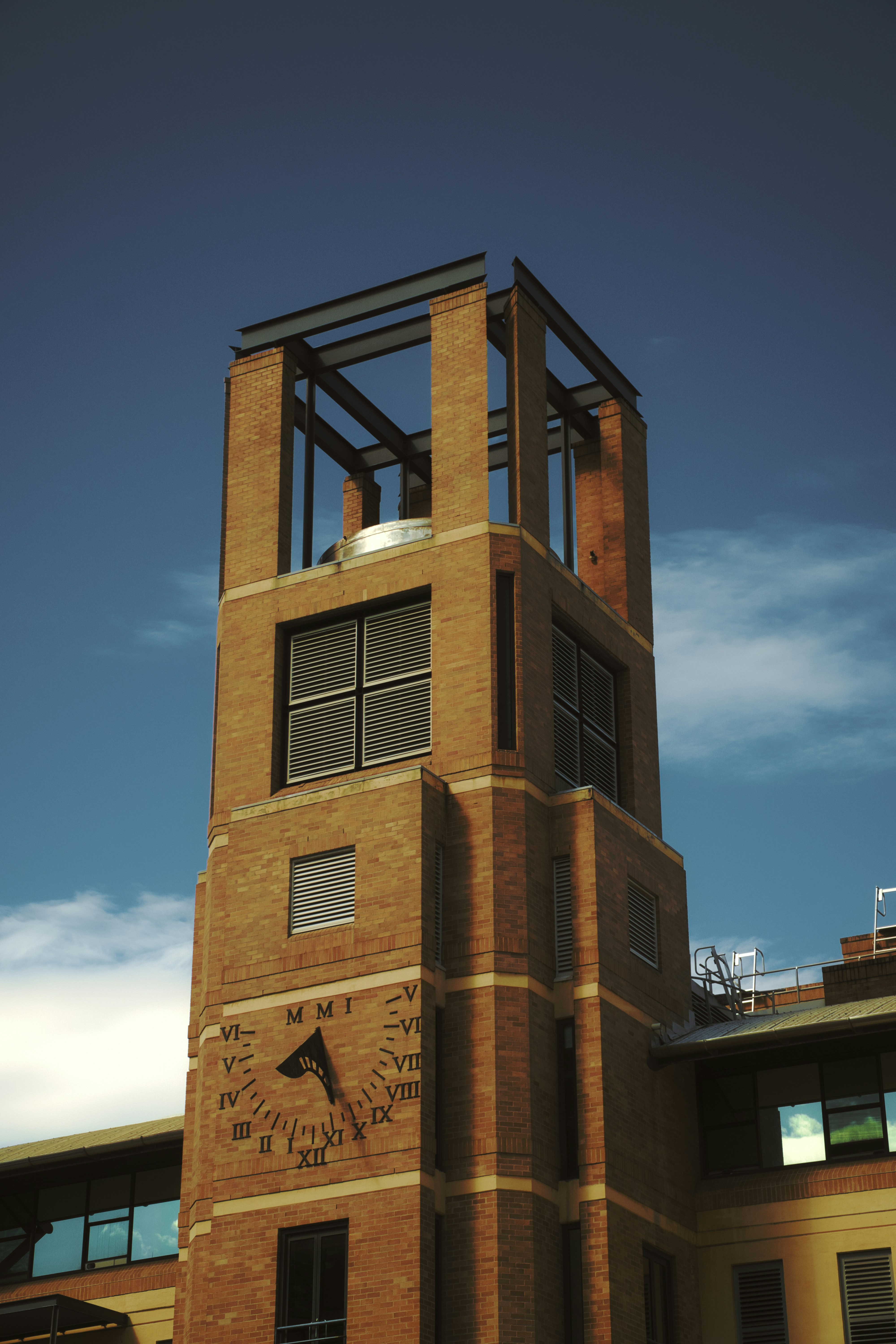 Brick Clocktower Rising Against a Clear Sky