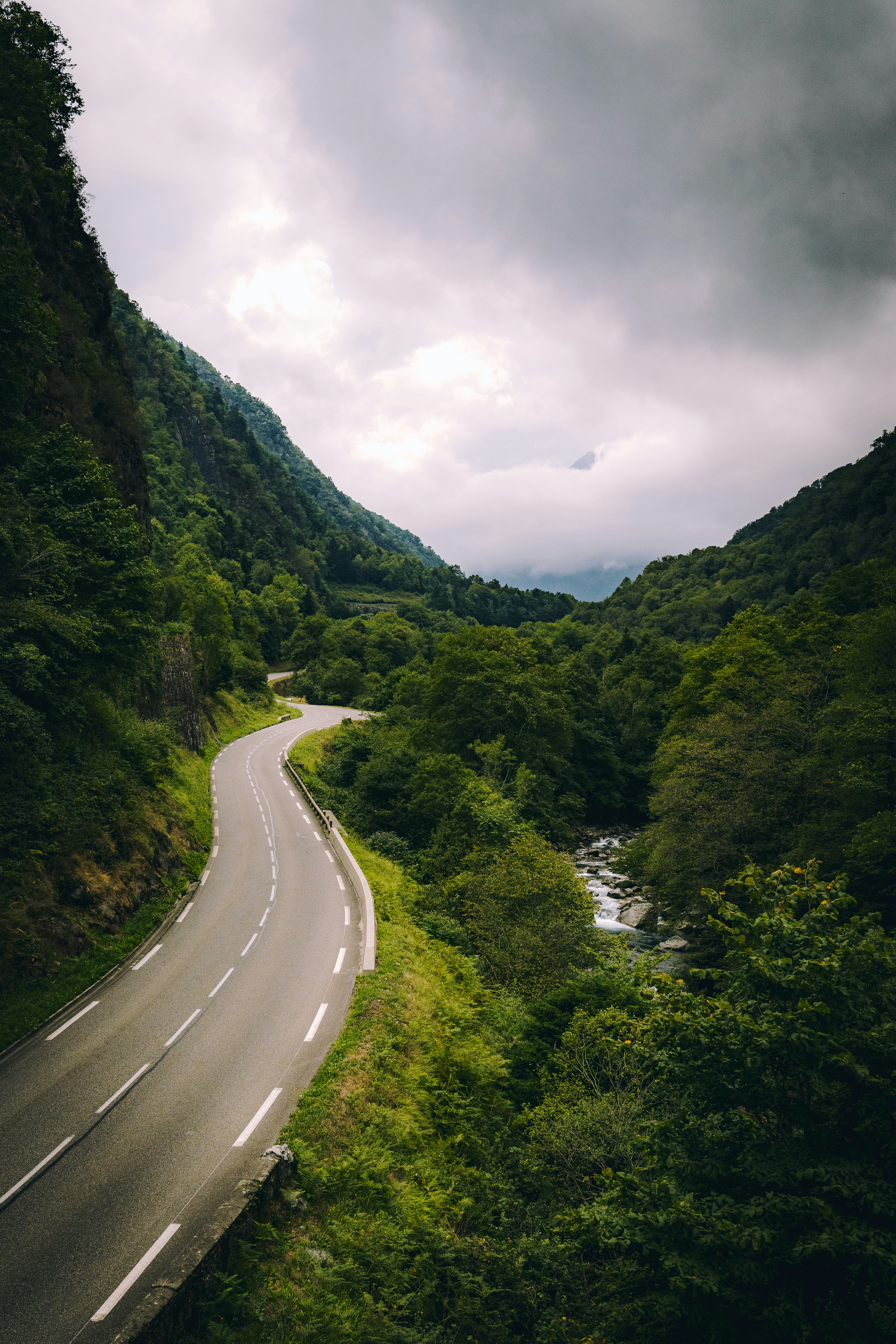 Curved Mountain Road Through Verdant Vales