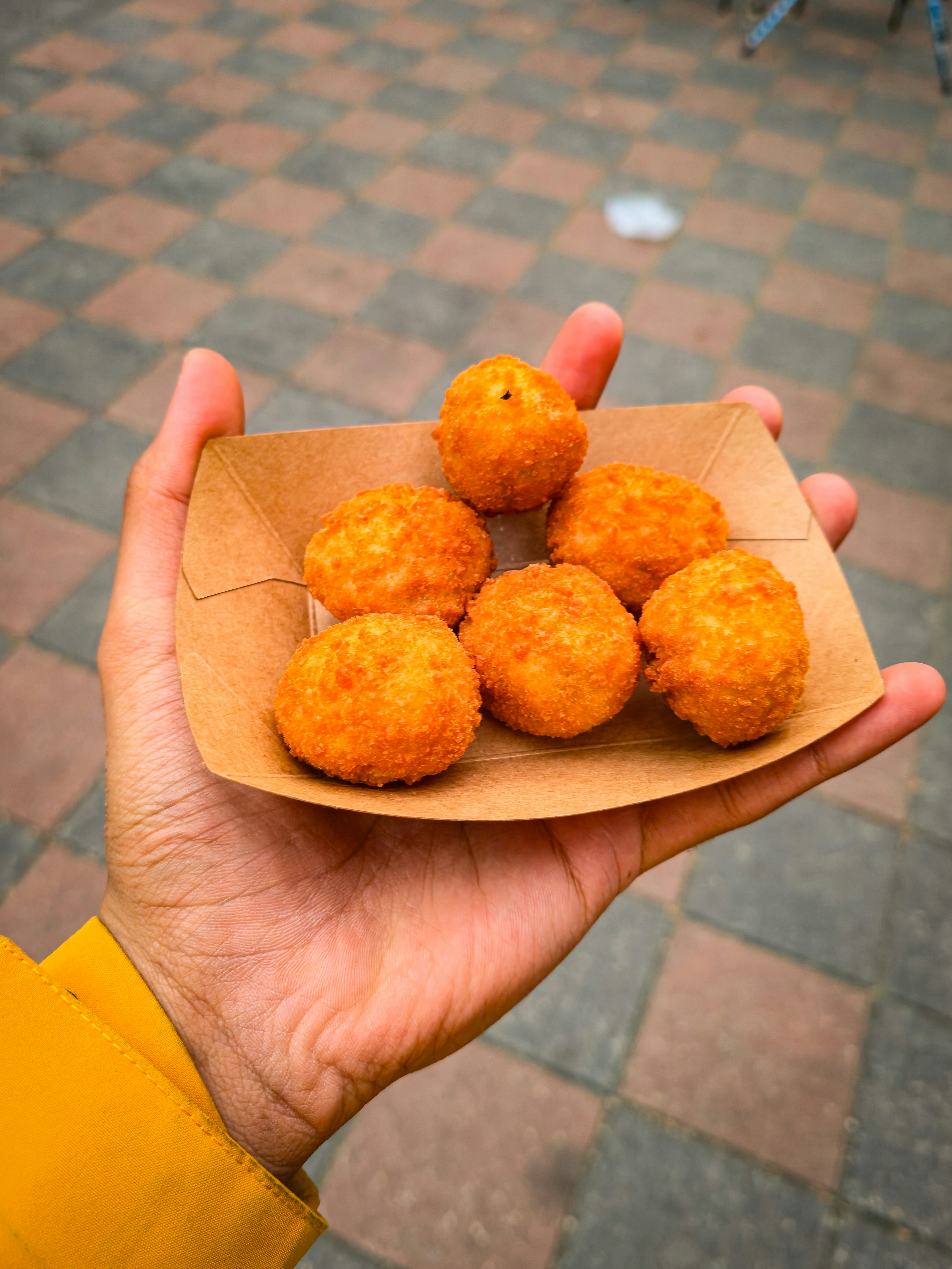 Golden Bites in a Handful of Street Snack Joy