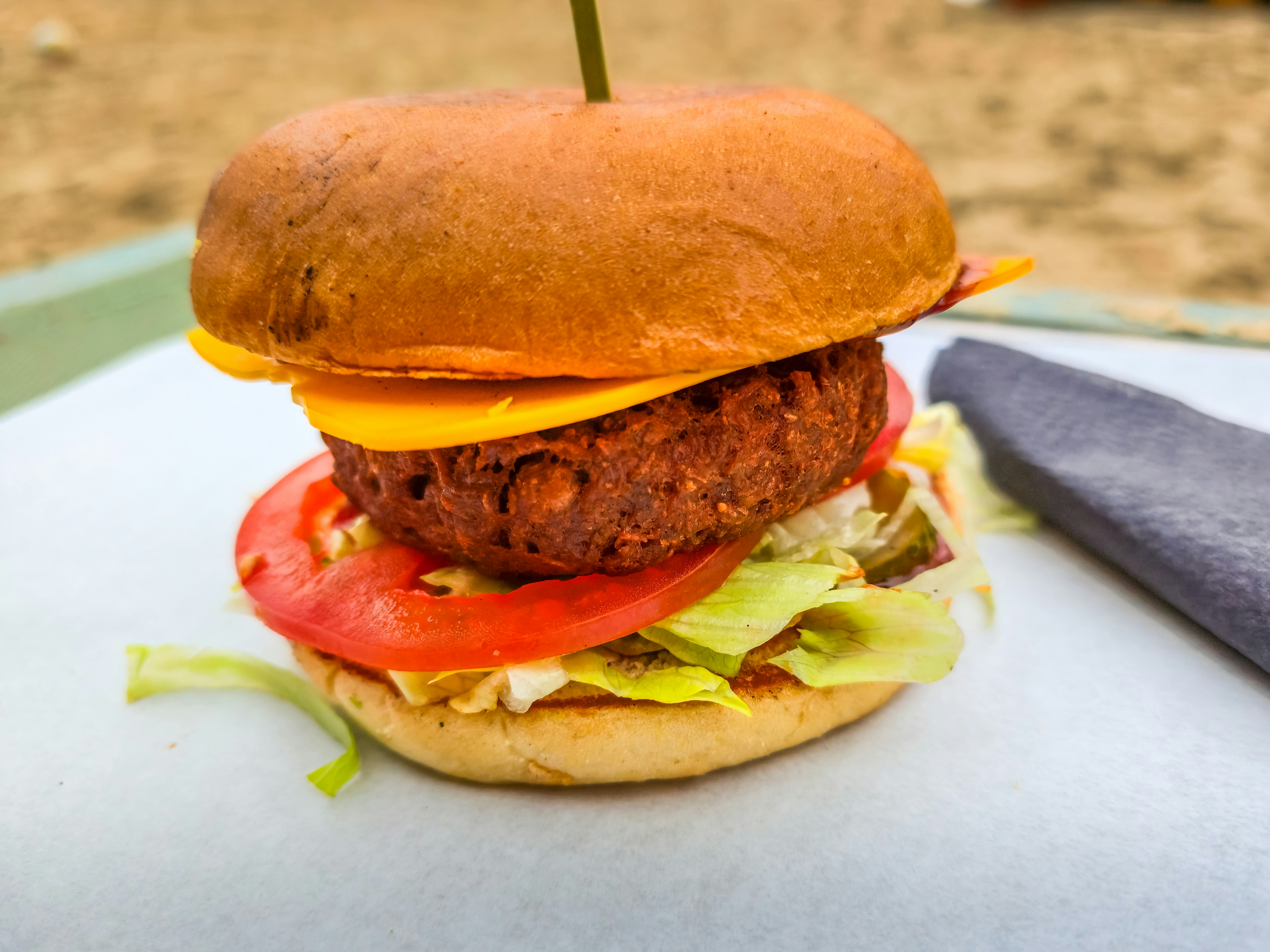 Street-side Burger Spotlight: A Chewy Patty Stack with Crisp Lettuce and Tomato