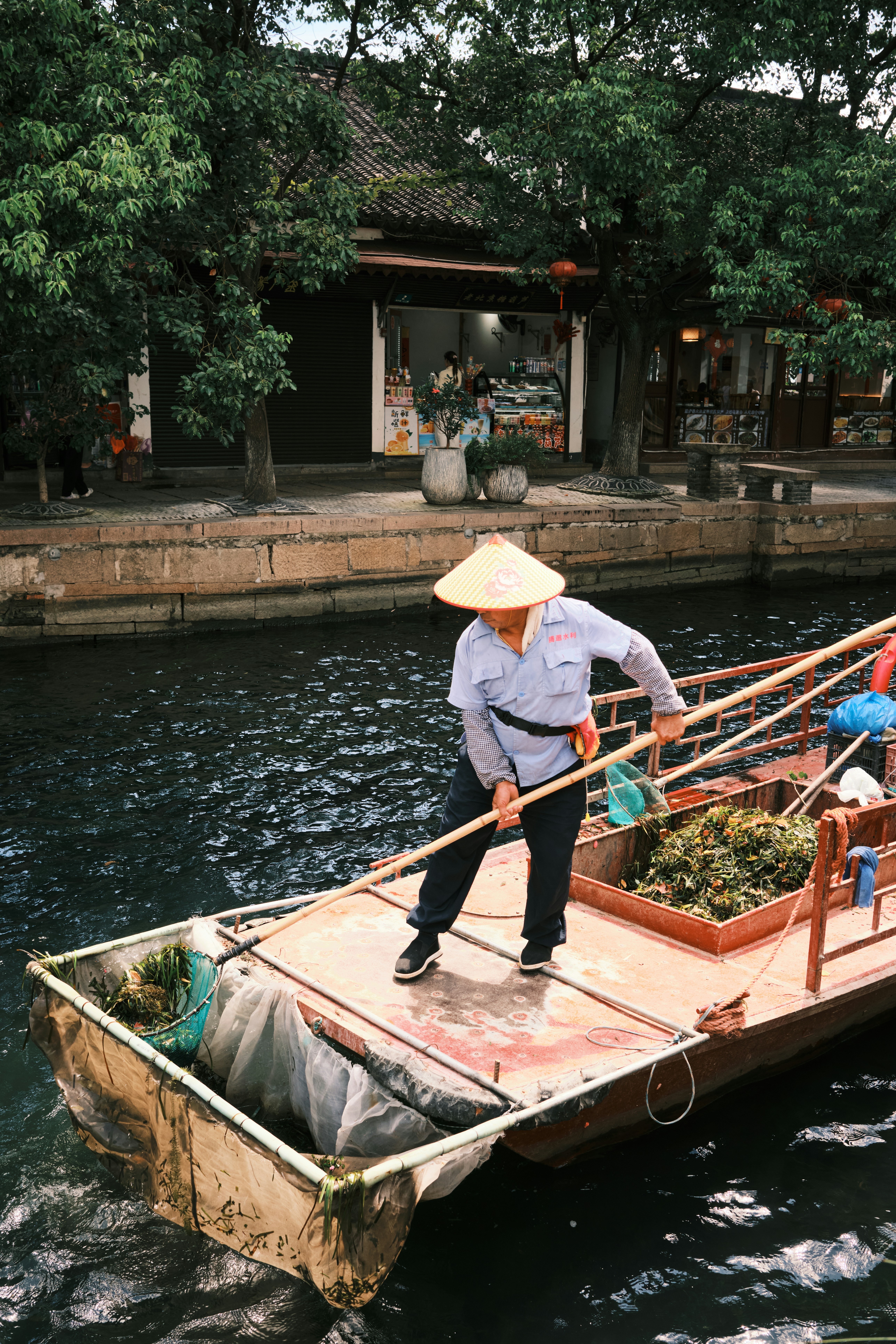Boatman in a Riverside Street Market