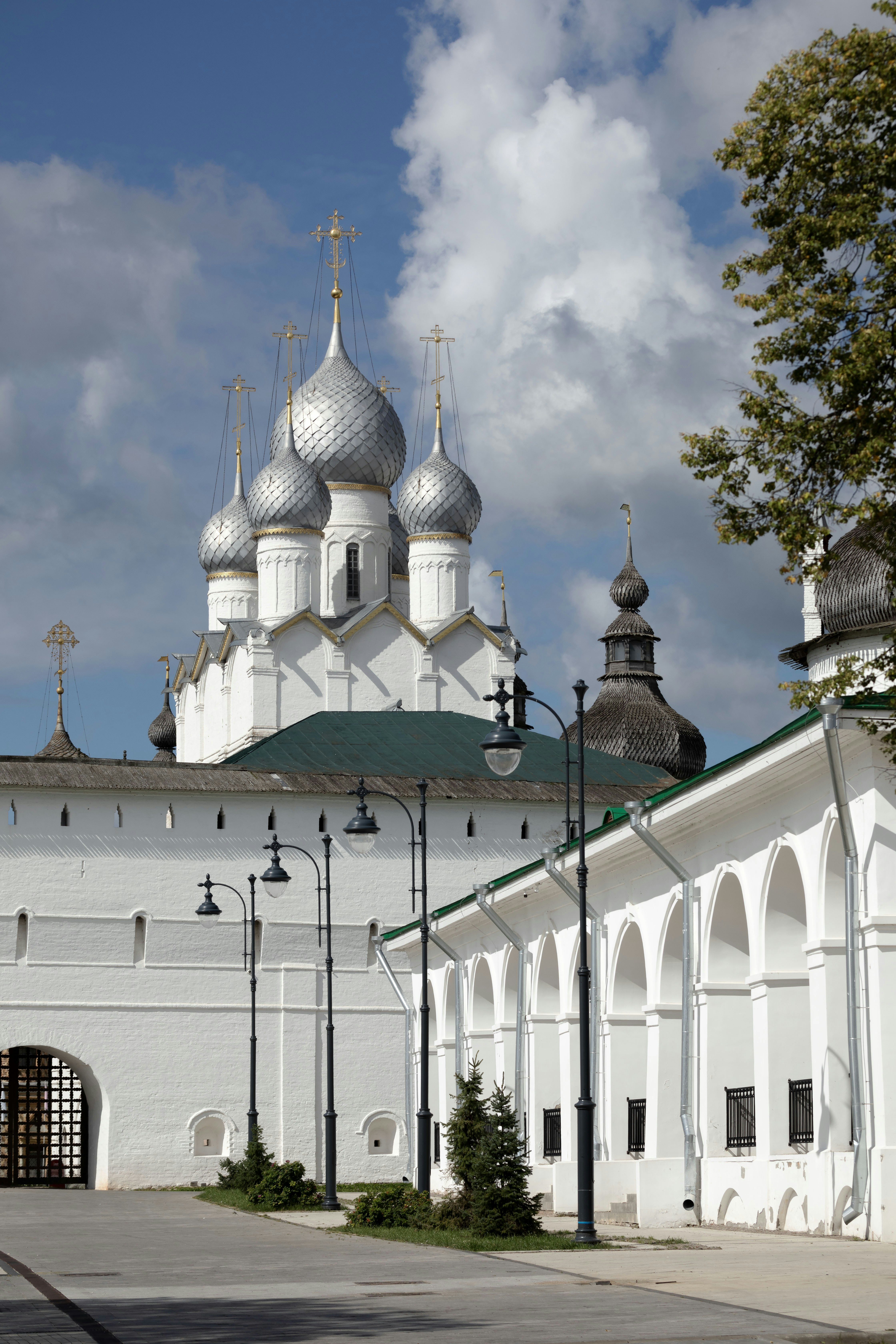 White Monastery Wings: Silver Domes Against a Blue Sky