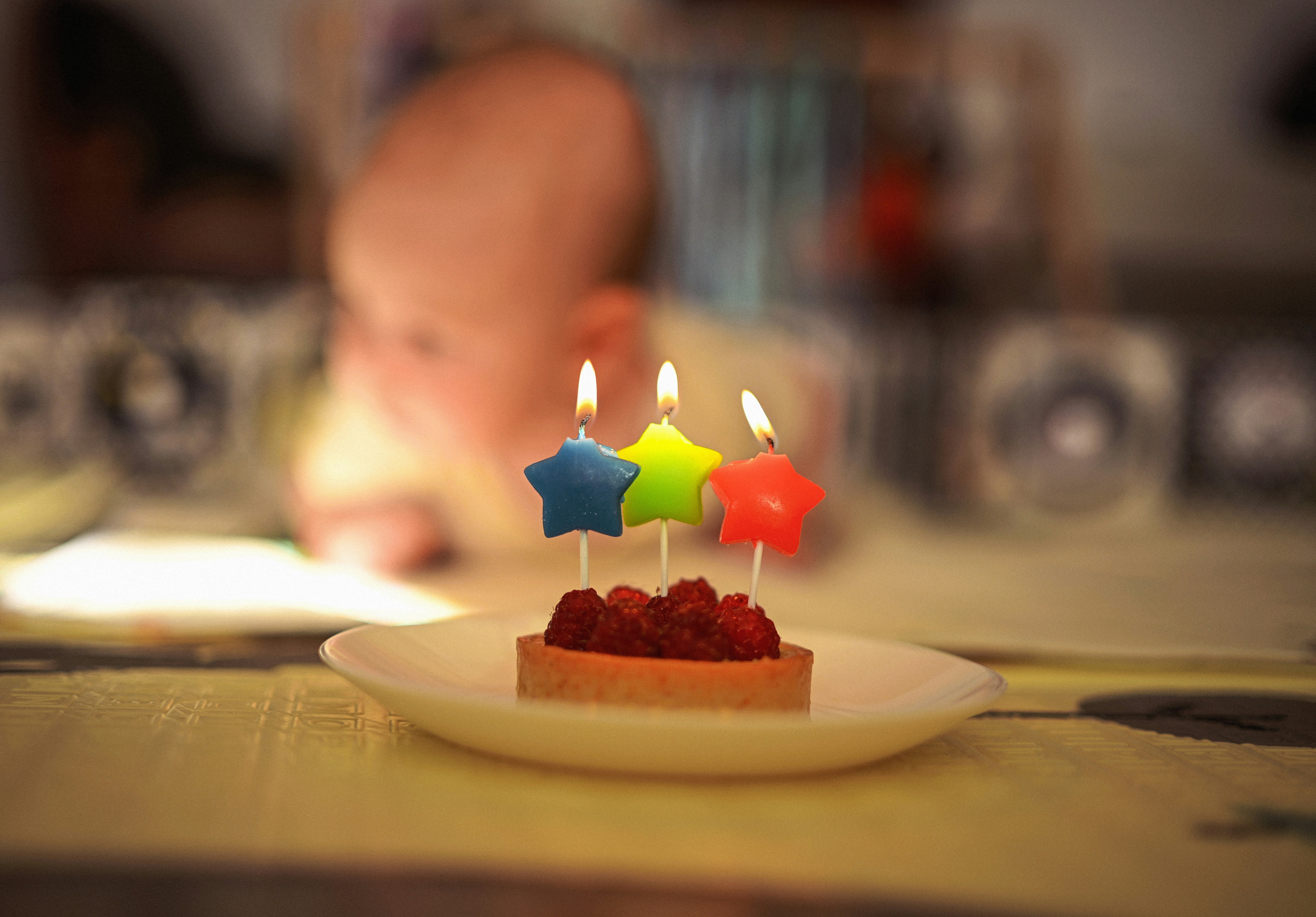 Birthday Candles on a Tiny Cake: A Moment of Quiet Celebration
