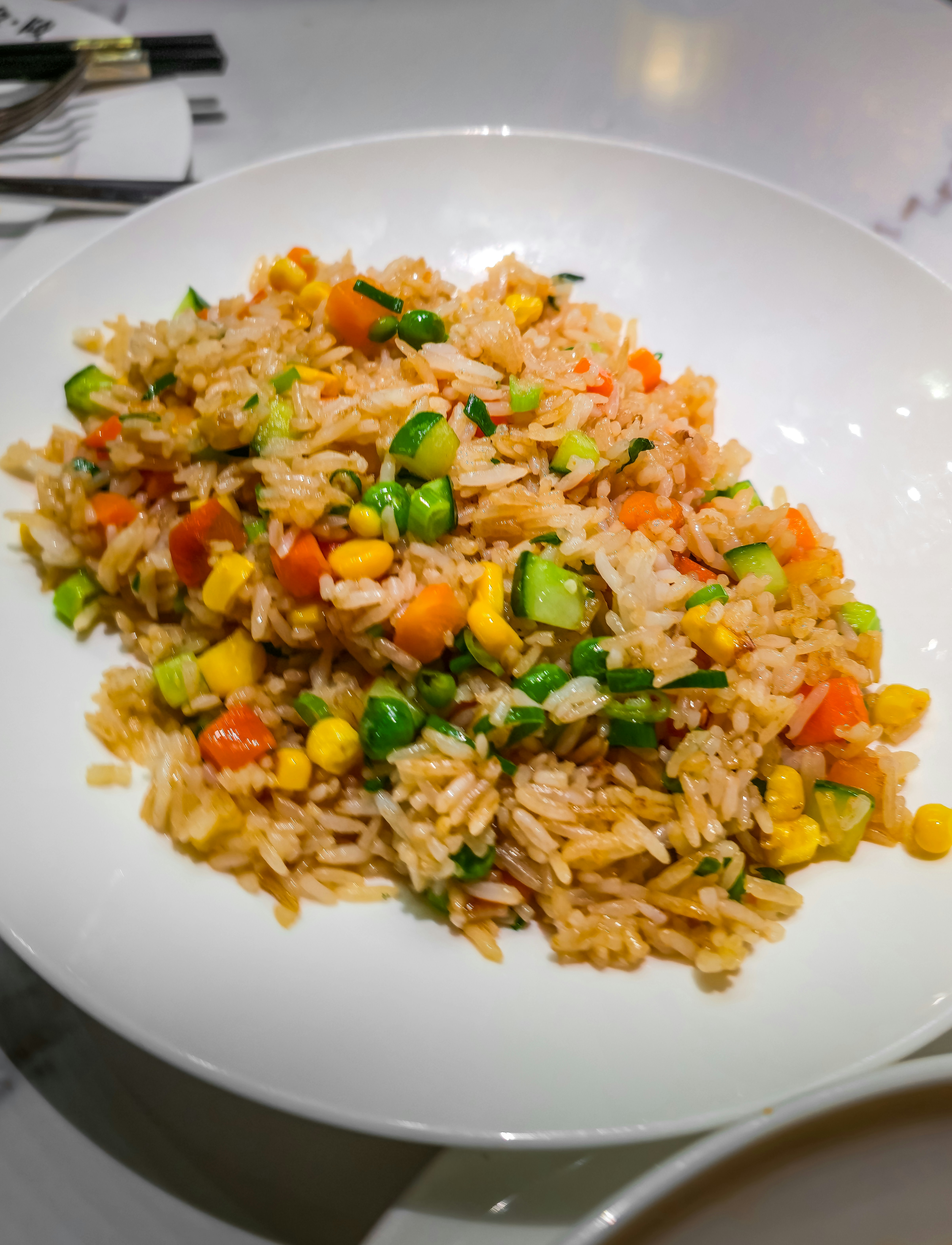 Colorful Fried Rice Mosaic on a White Plate