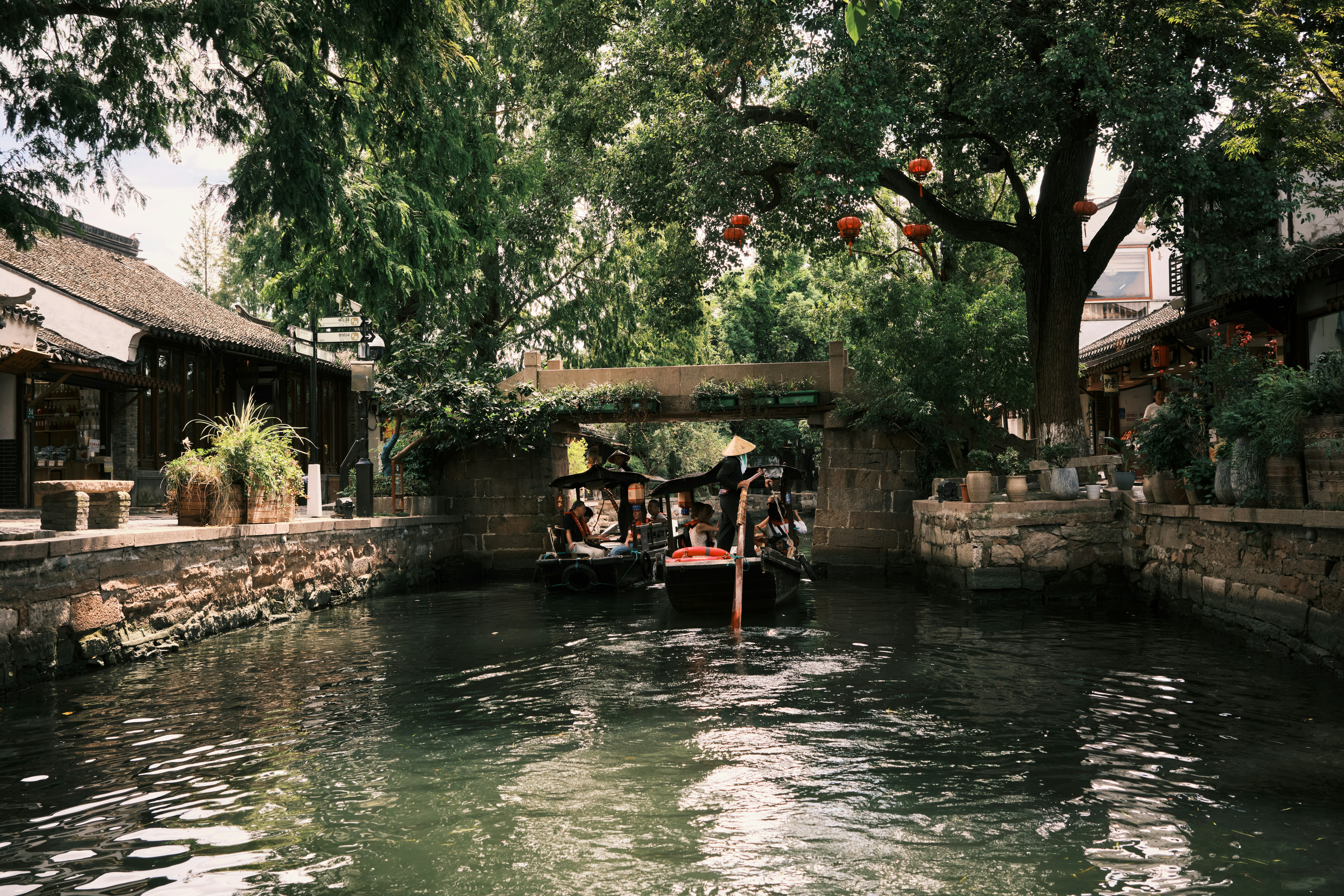 Quiet Canal Crossing Under Shaded Canopy