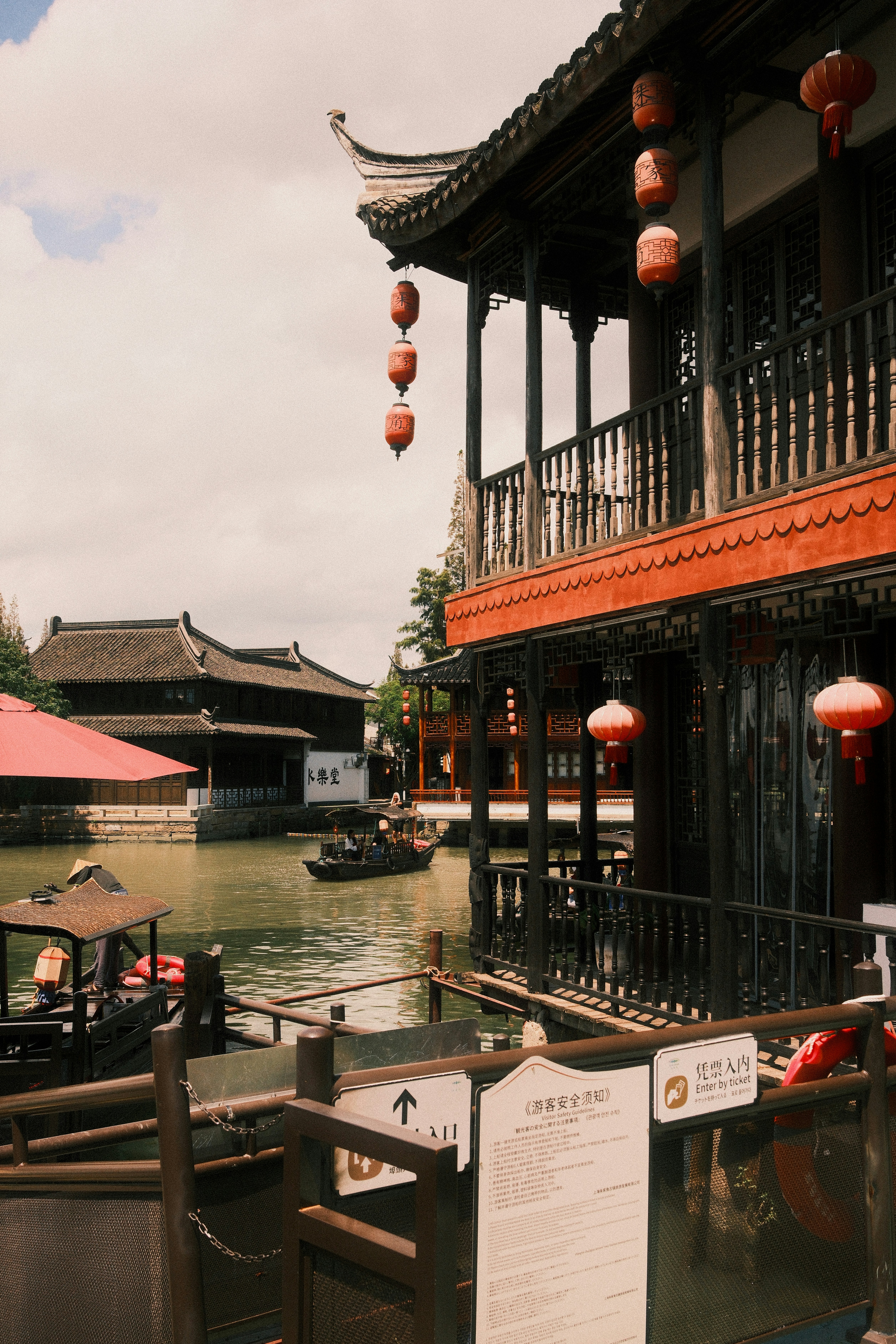 Harbor Town Balcony: Lanterns, Waterways, and Painted Eaves