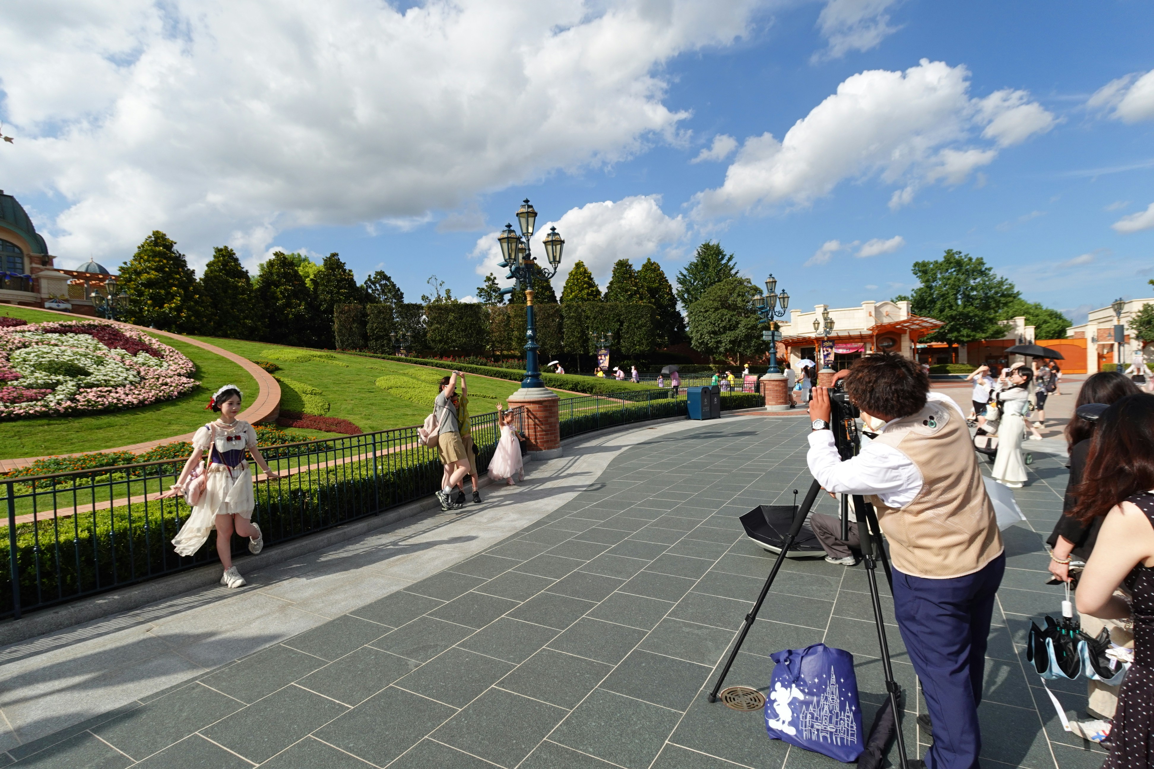 Photographer at Work Capturing Park Scene with Costumed Figures