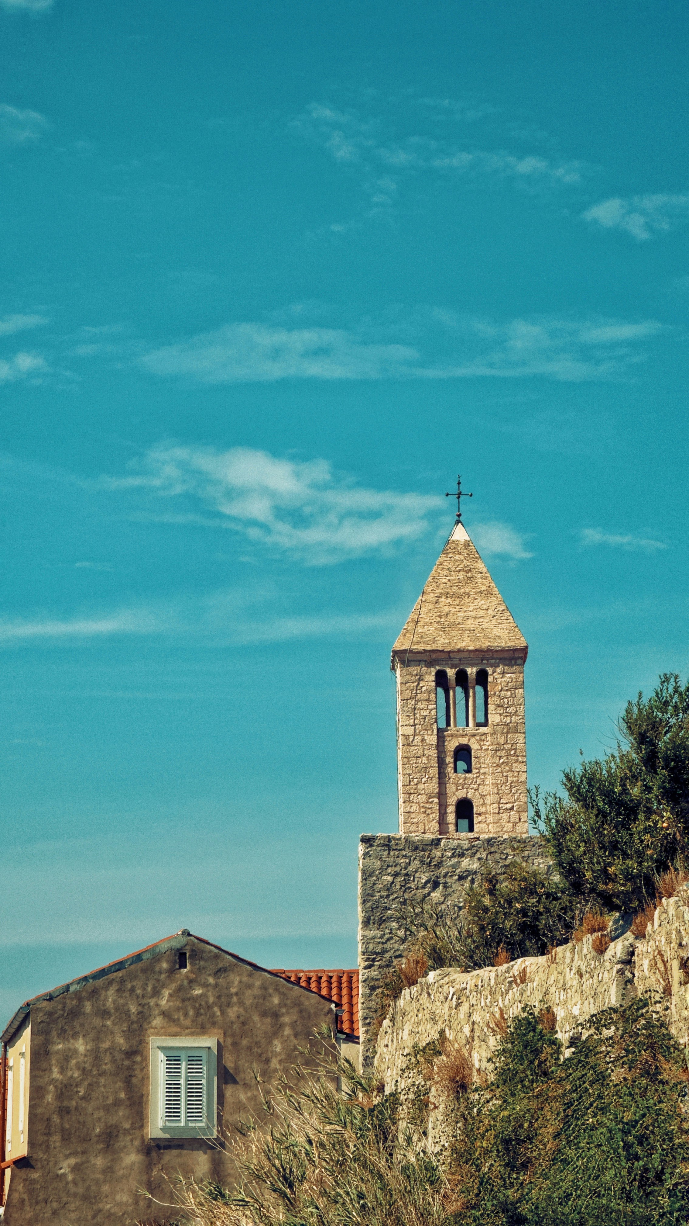 Stone Bell Tower Reaching Toward a Clear Sky